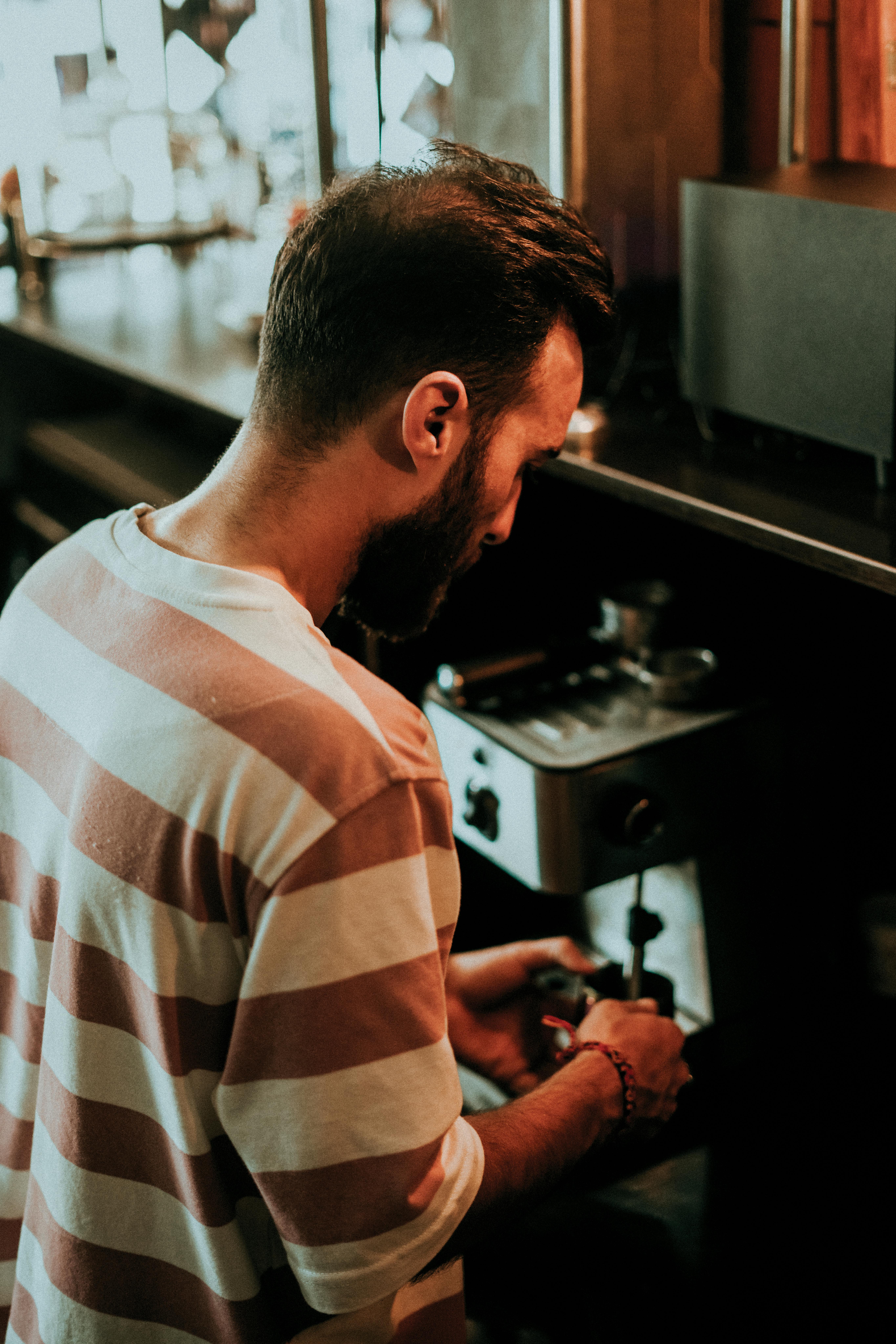 Man Standing by Coffee Machine · Free Stock Photo