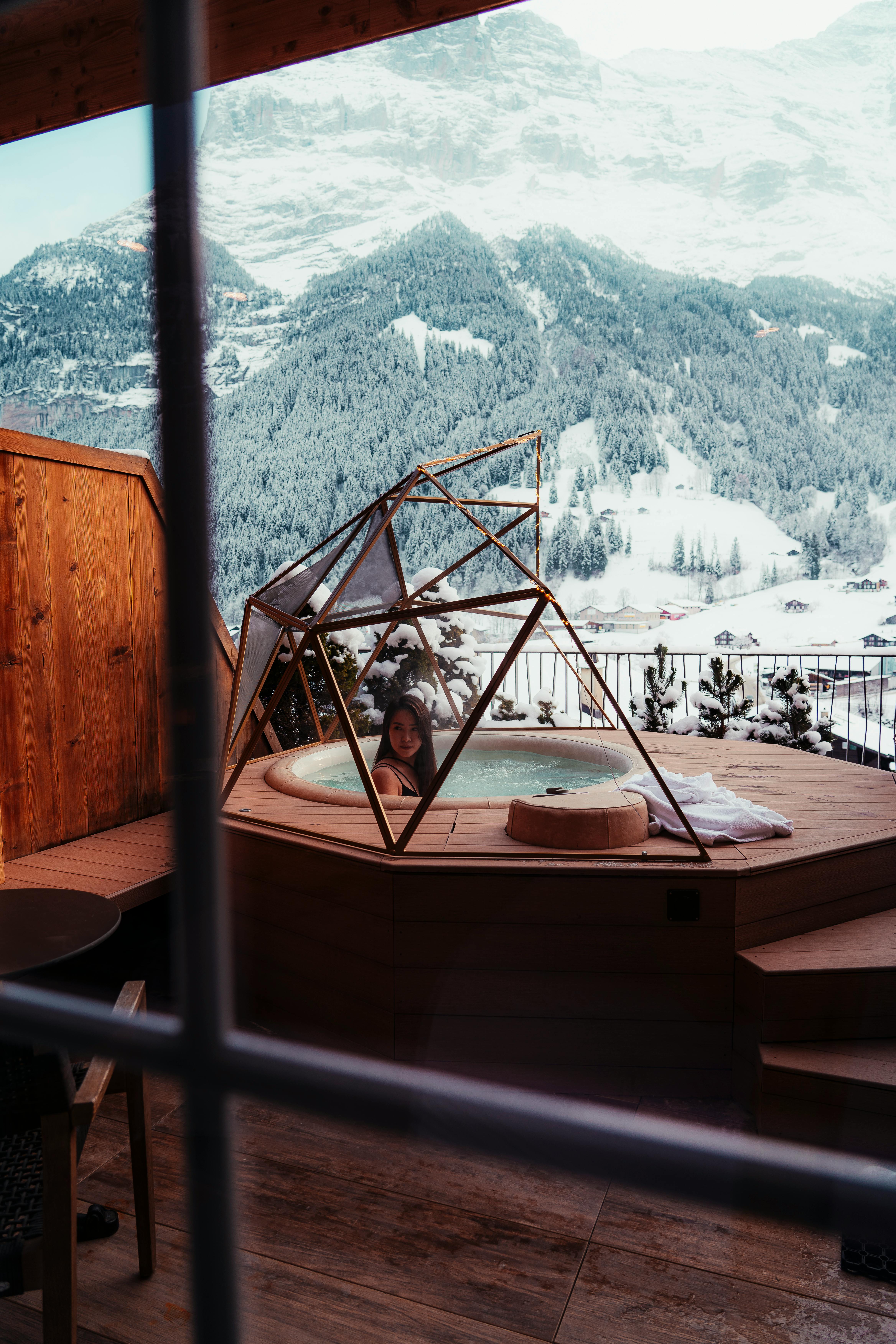 Woman in Jacuzzi on Terrace in Mountains in Winter · Free Stock Photo