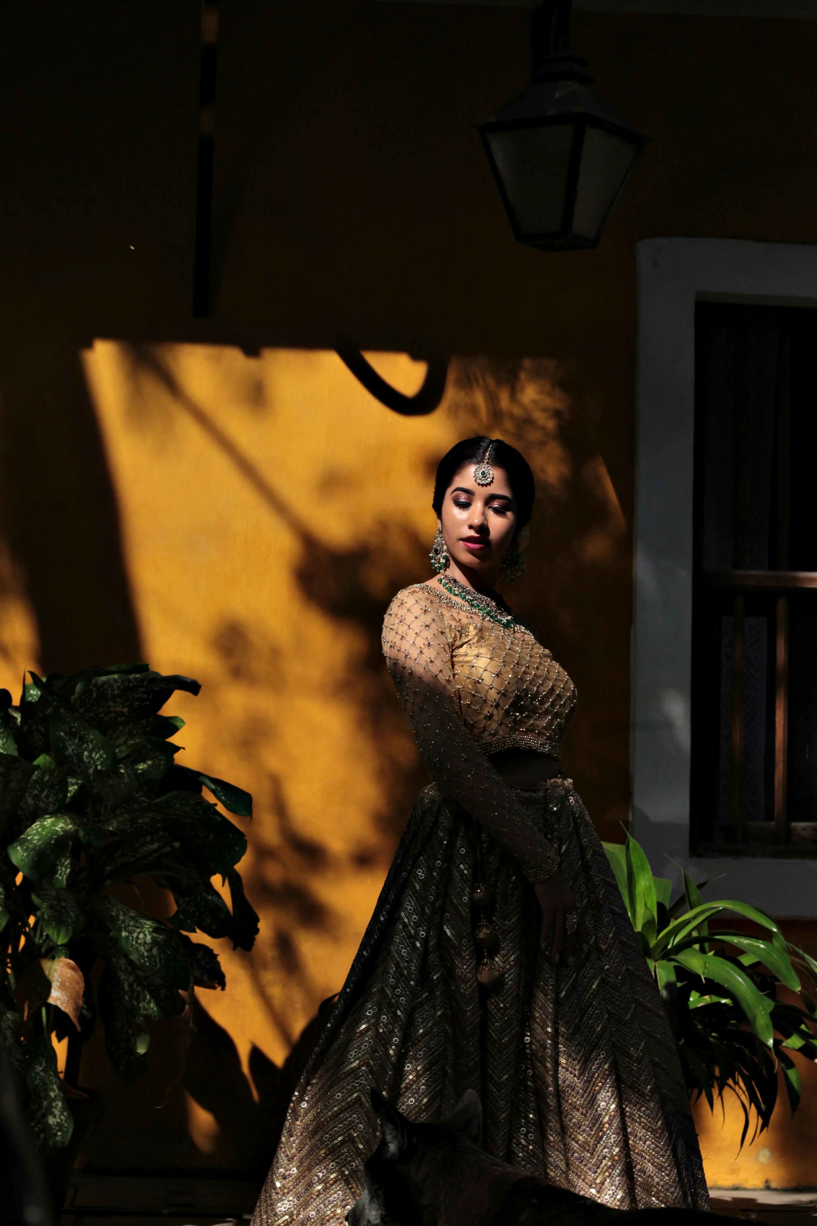 Woman in Traditional Dress in Shadow · Free Stock Photo