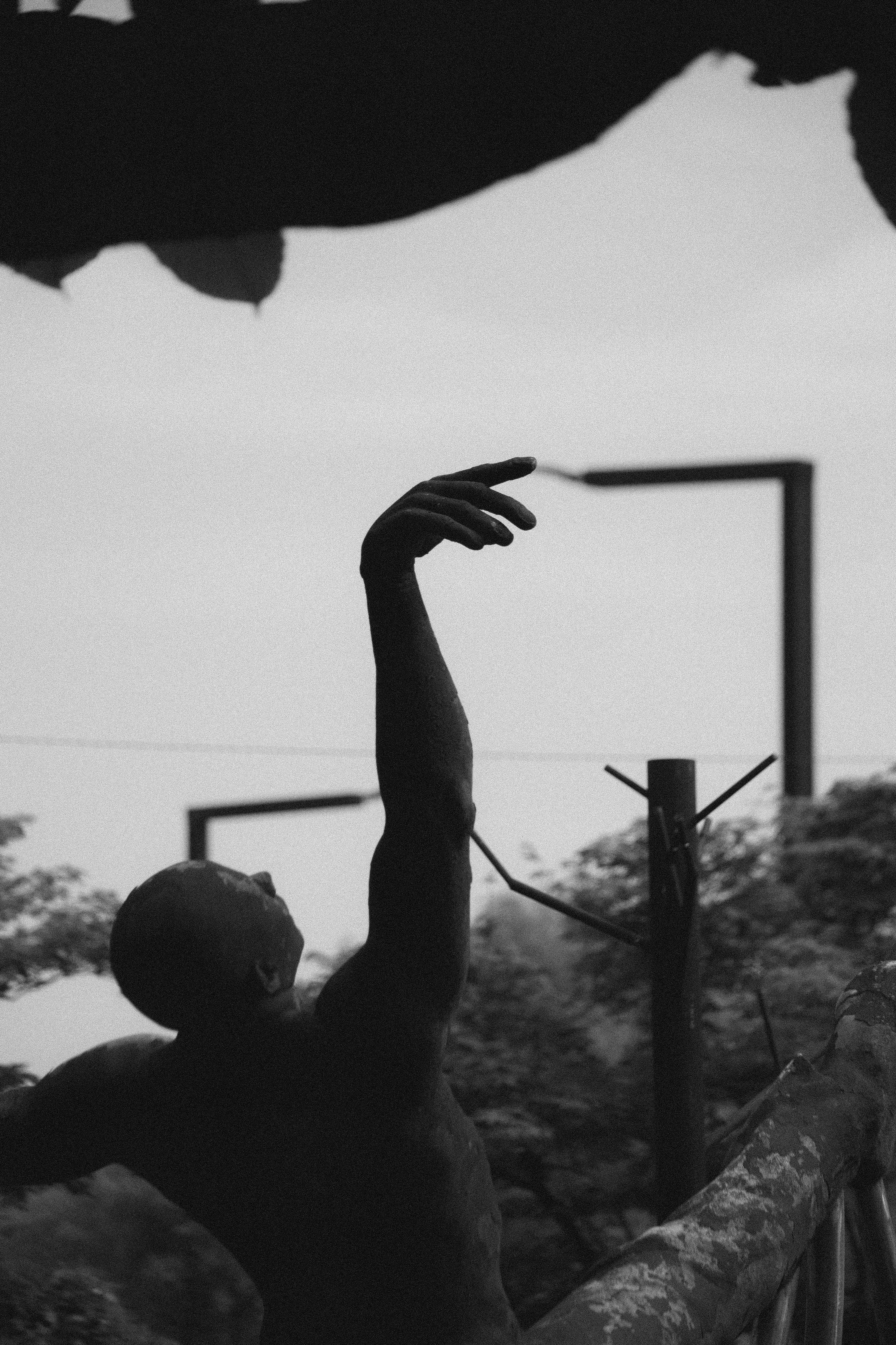 Black and White Picture of a Man Leaning Backwards with Arms Raised ...