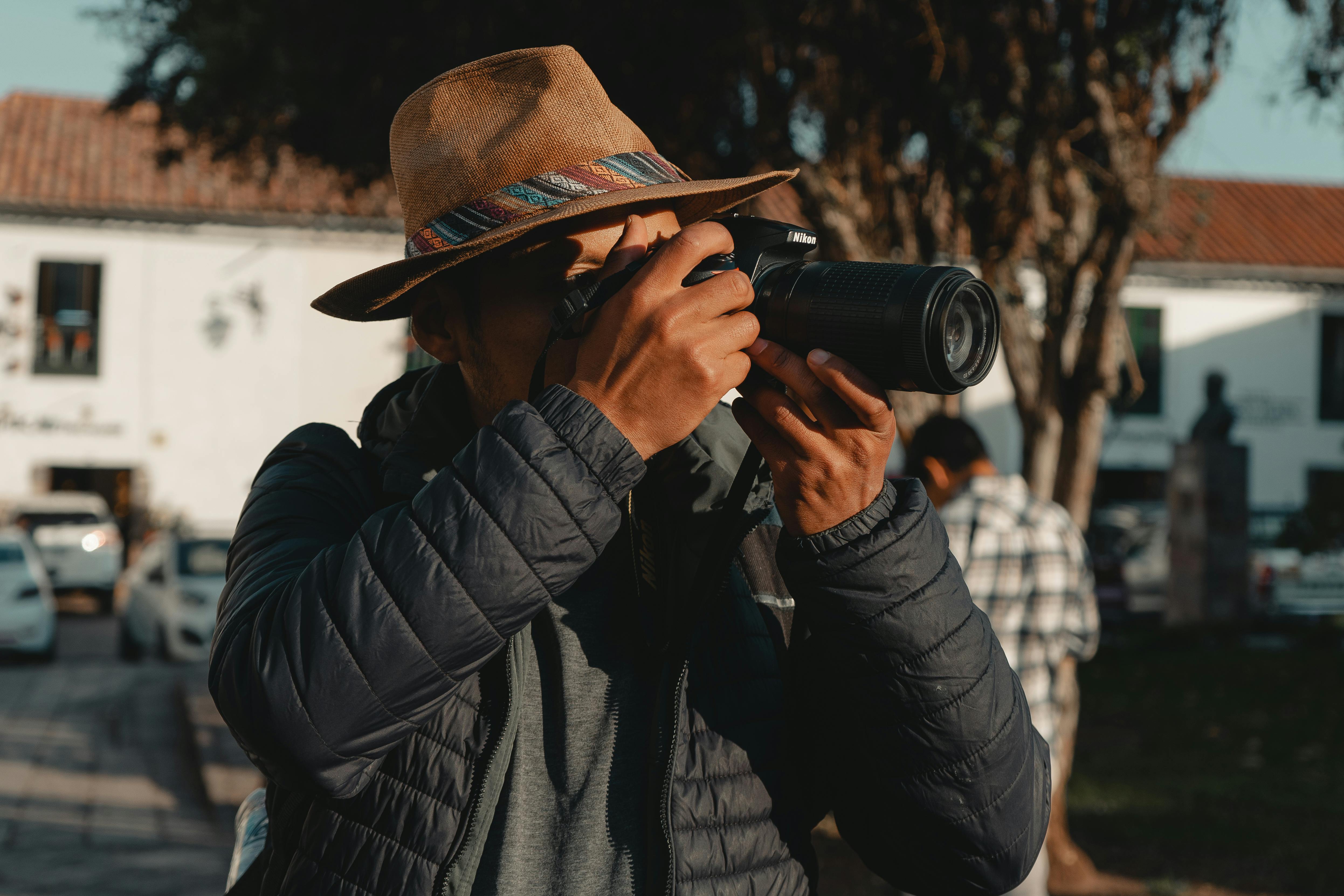Man Holding Camera against Rocks · Free Stock Photo