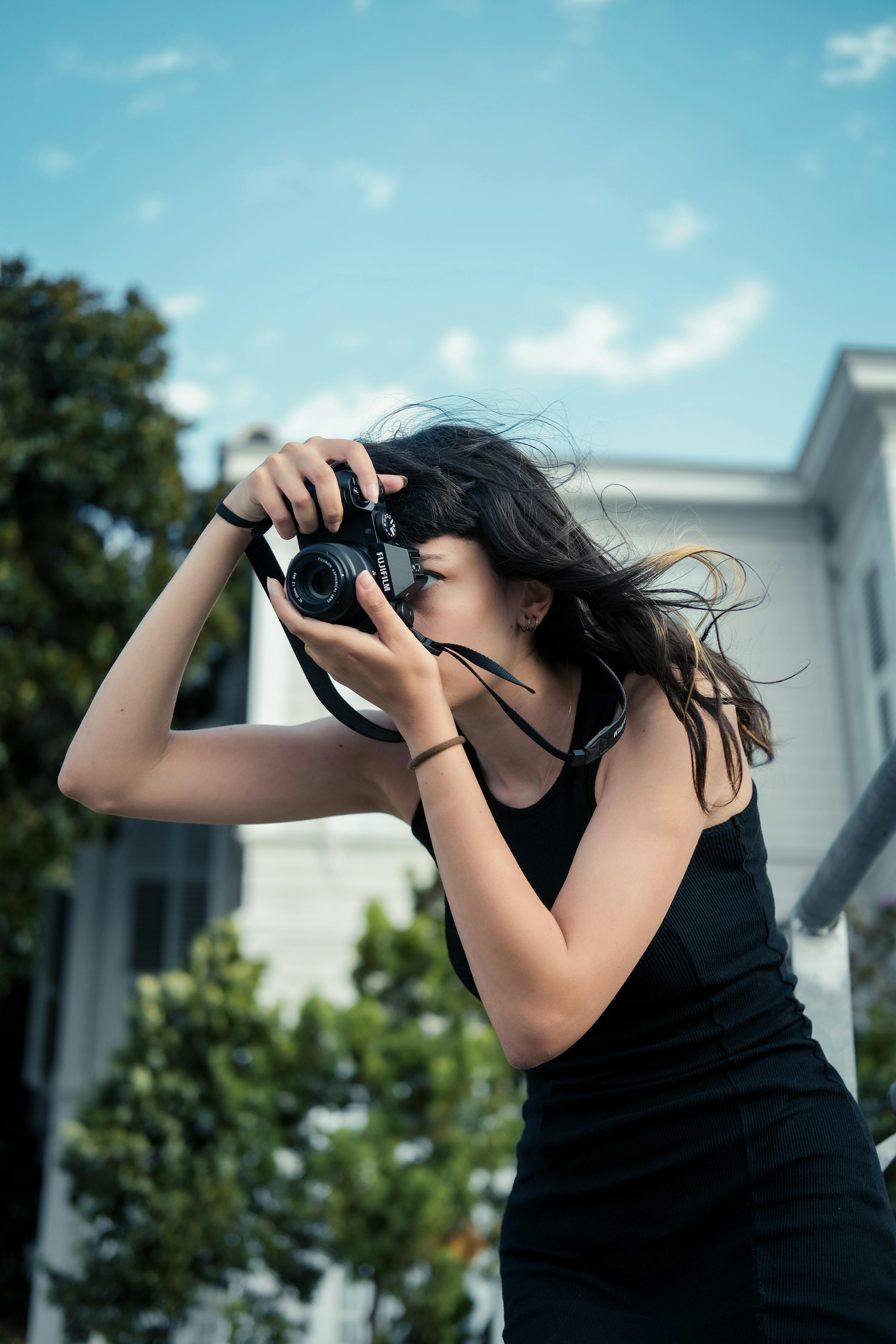 Photographing Woman in Black Tight Dress · Free Stock Photo