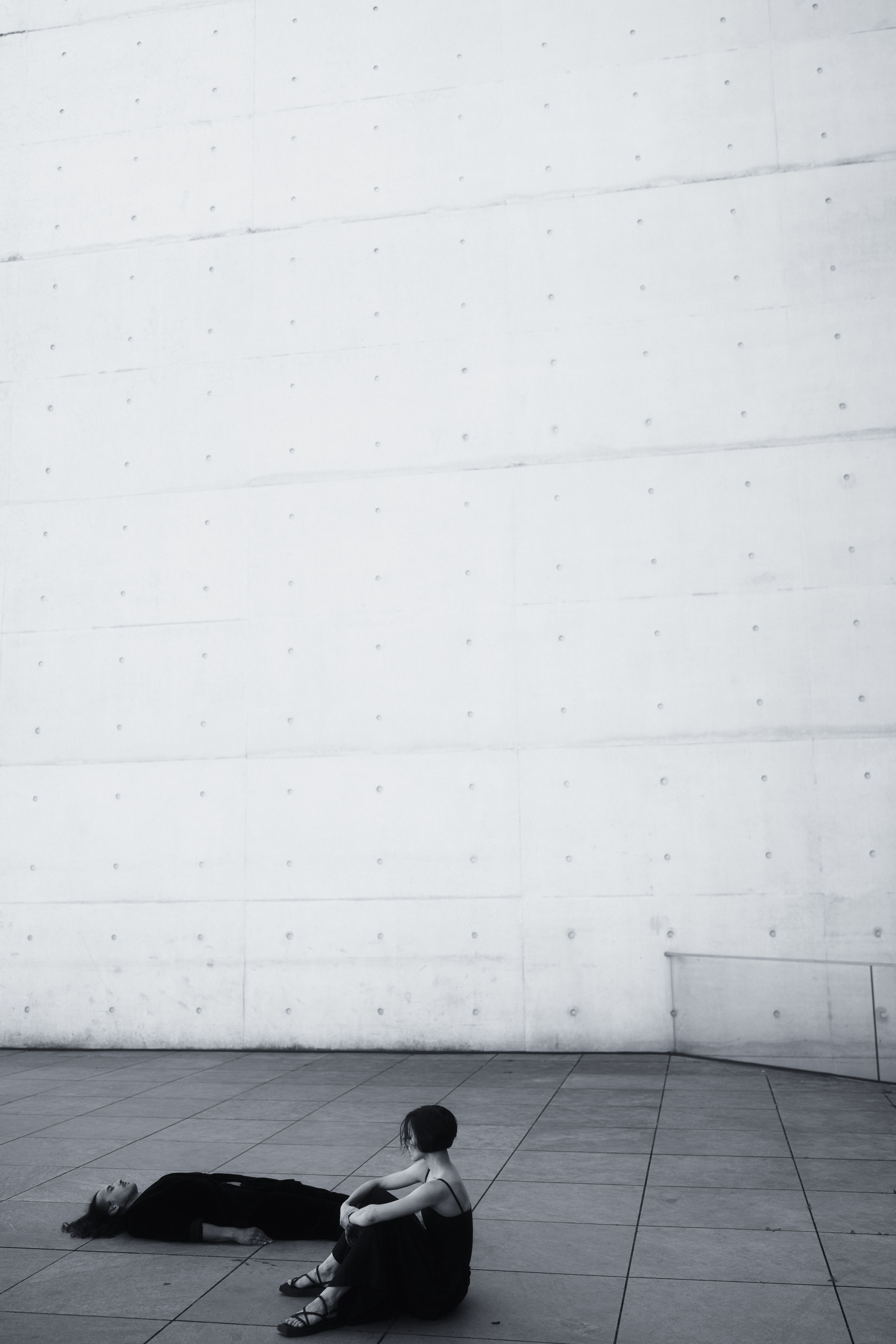 Woman and Man Sitting and Lying Down on Pavement · Free Stock Photo