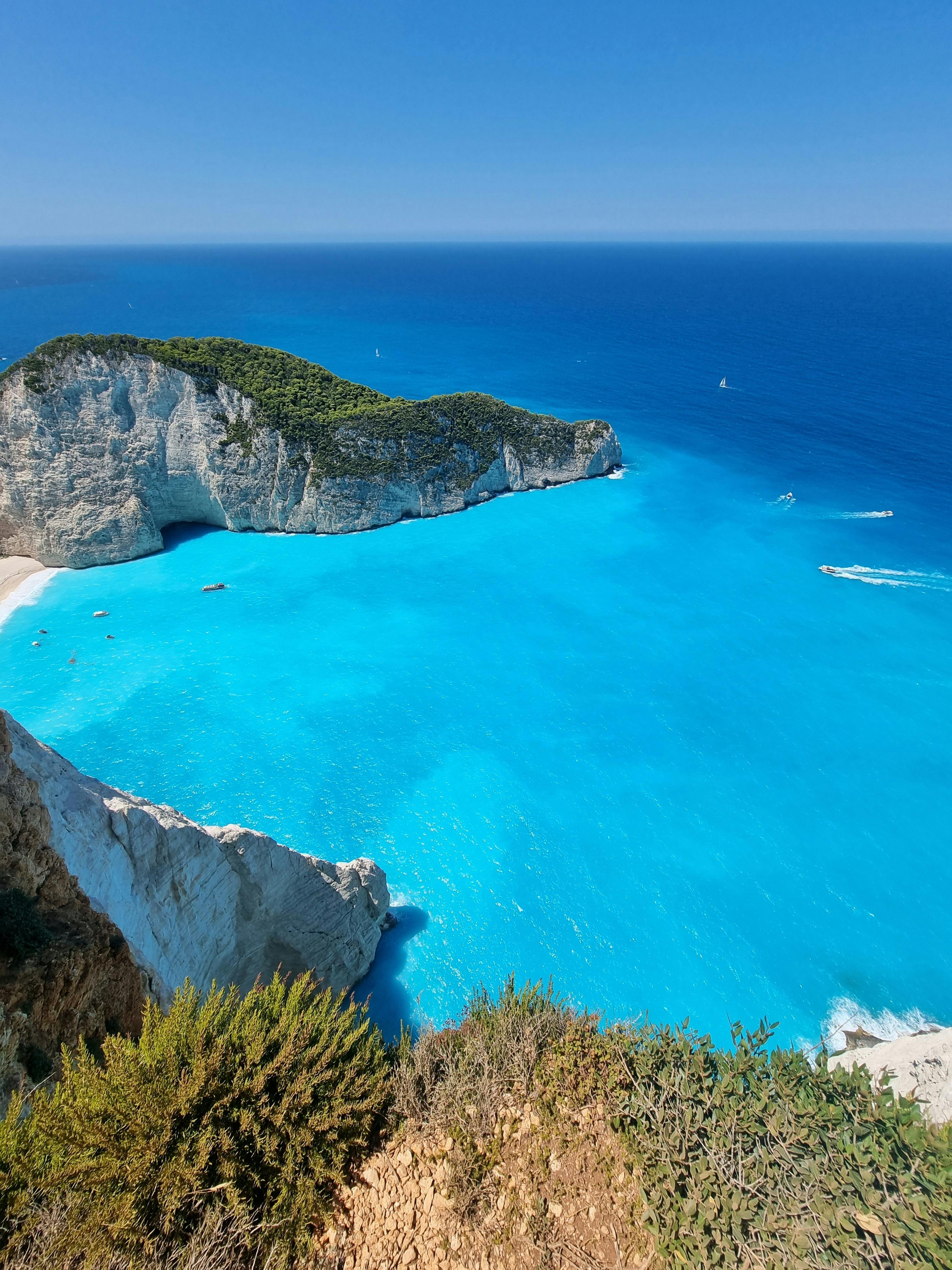 Blue Sea Under Clear Blue Sky · Free Stock Photo
