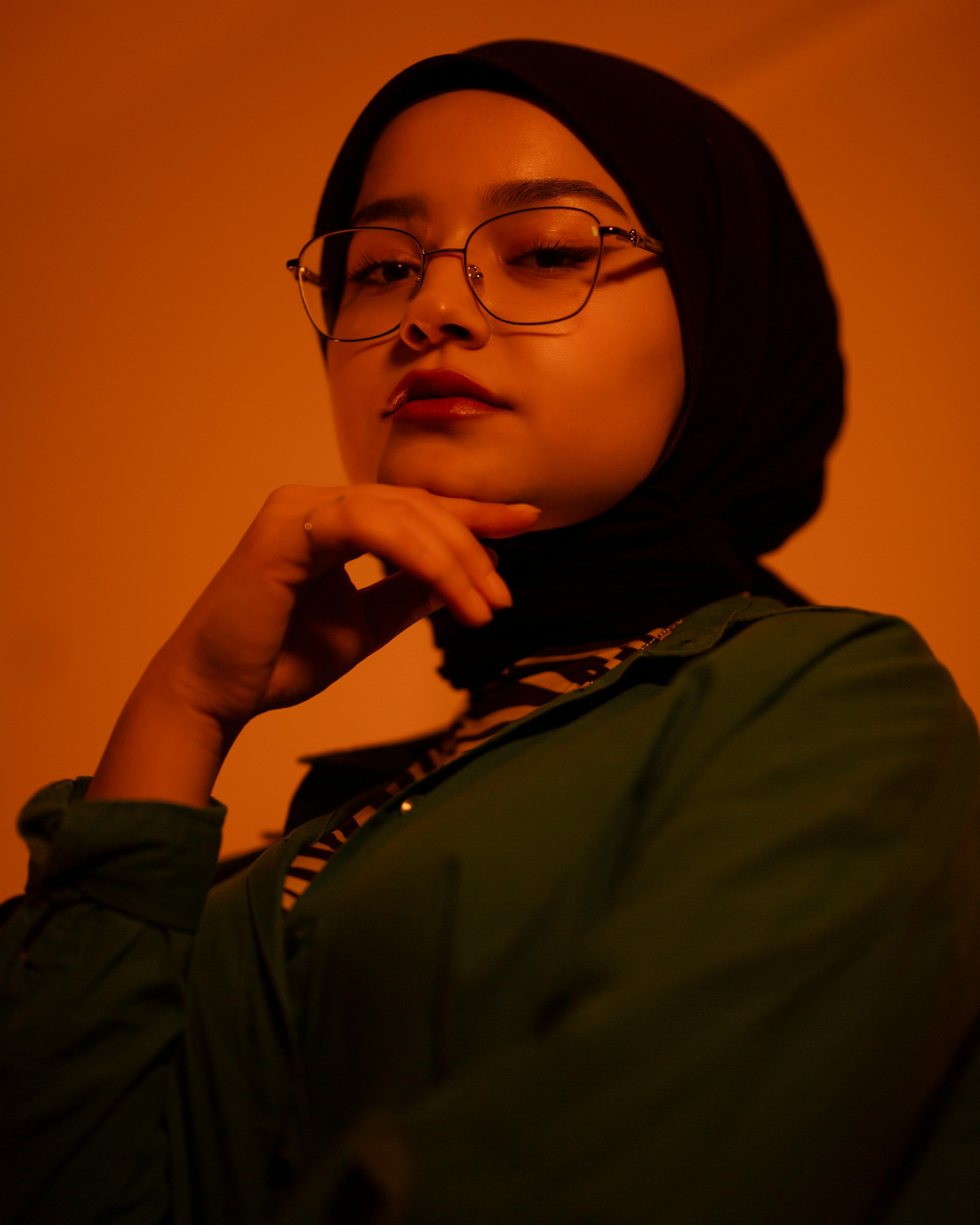 Portrait of Hijabi Woman under Orange Light · Free Stock Photo