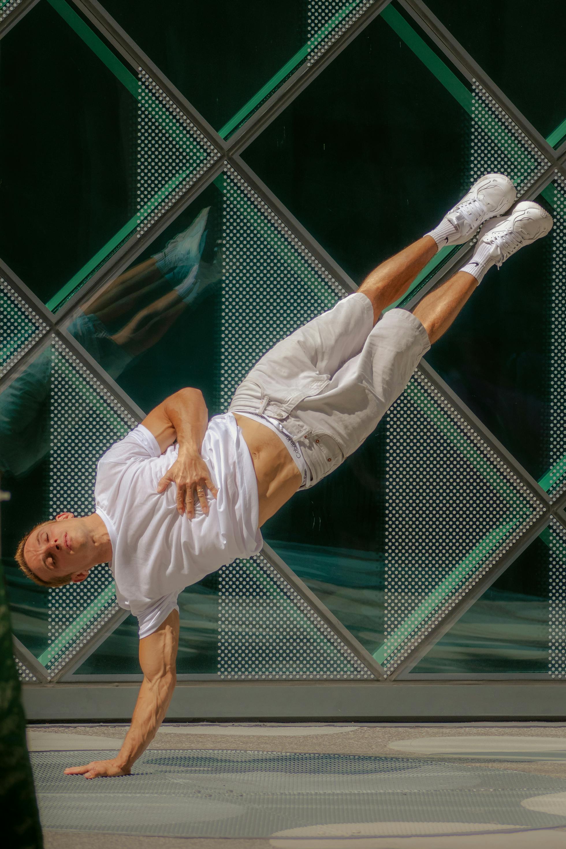 Man in T-shirt Breakdancing · Free Stock Photo
