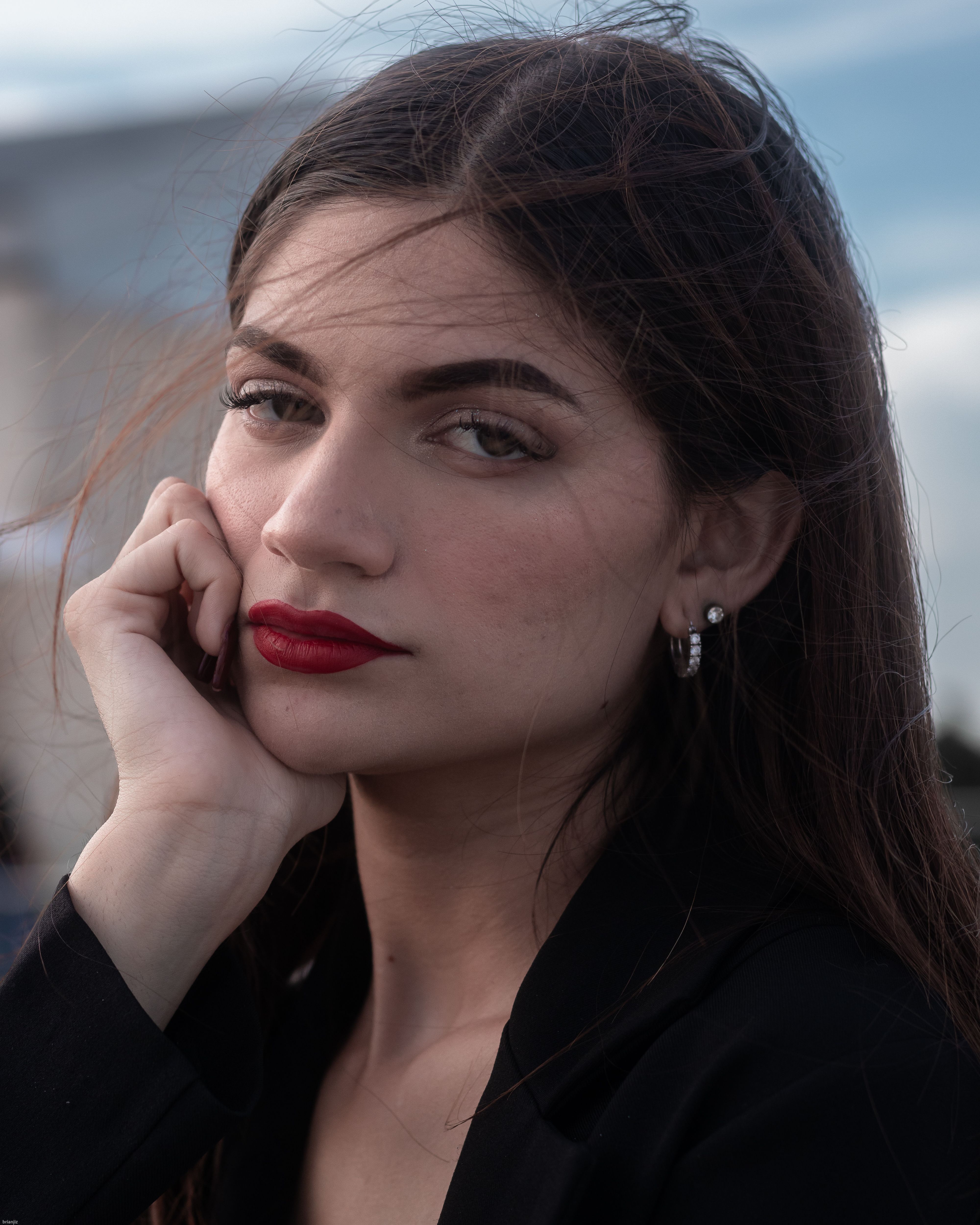 Portrait of Woman with Hand on Cheek · Free Stock Photo