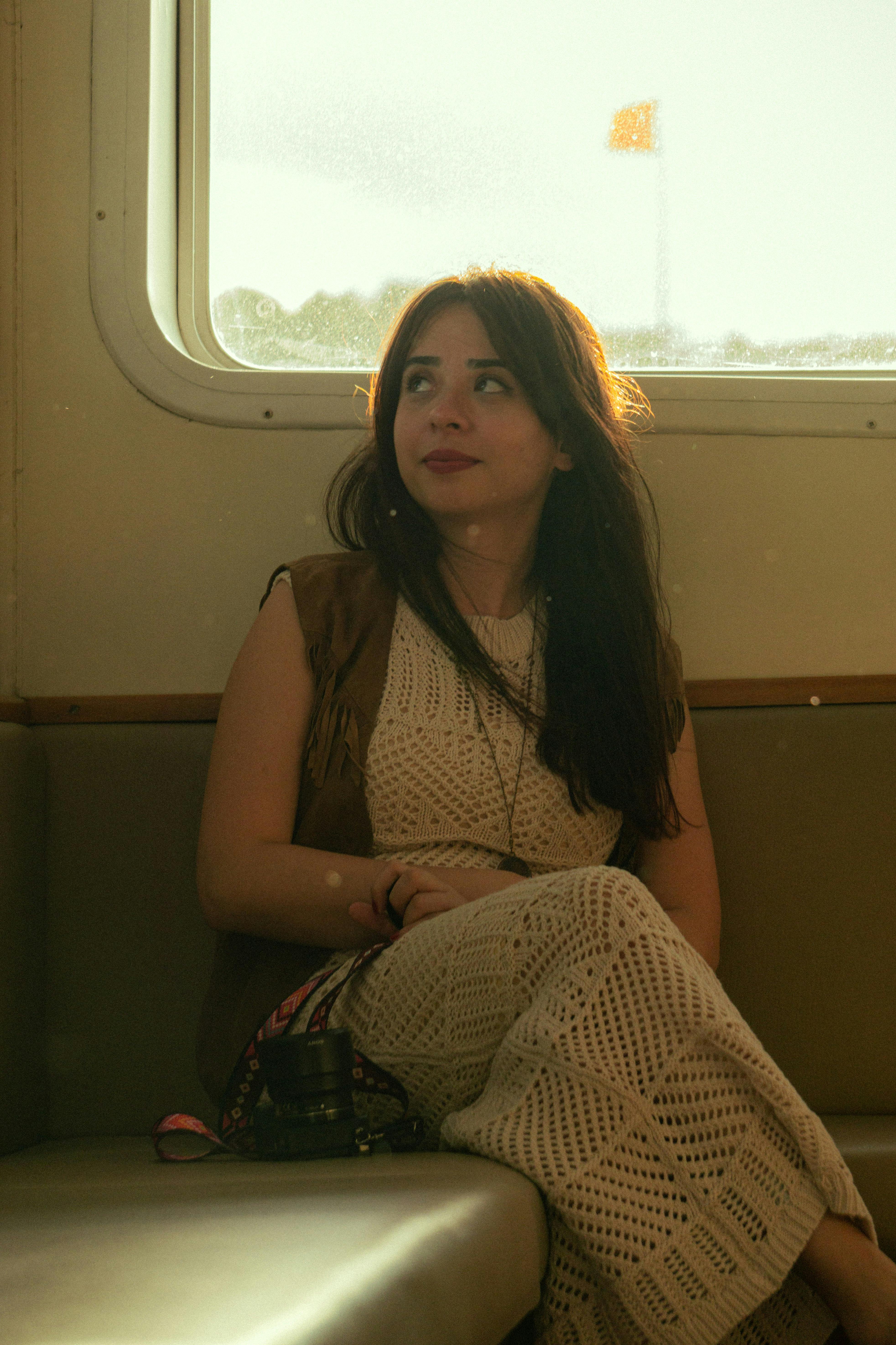 Young Woman in Leather Vest and Crochet Dress Sitting in a Ferry Ship ...
