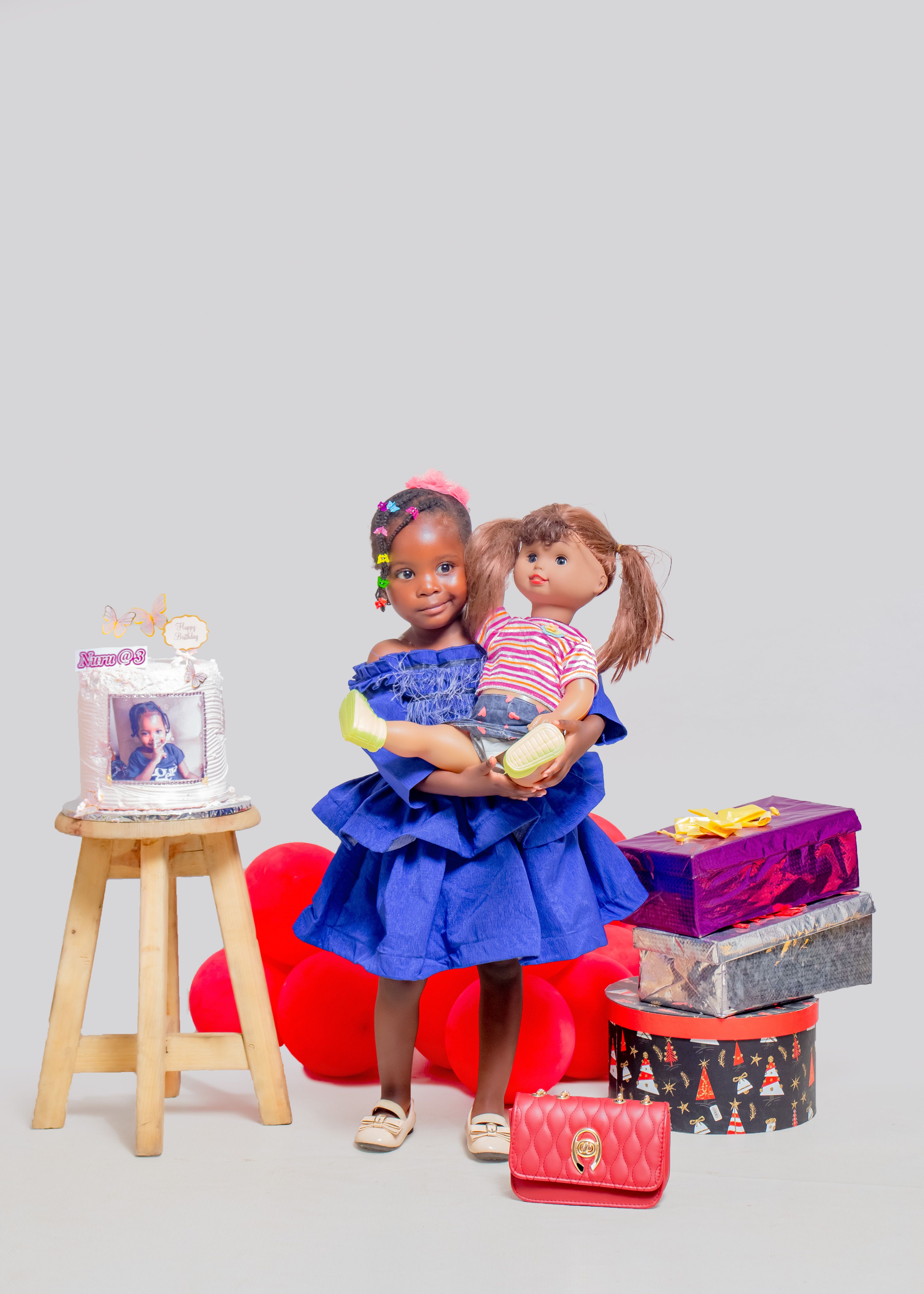 Little Girl Holding a Doll · Free Stock Photo