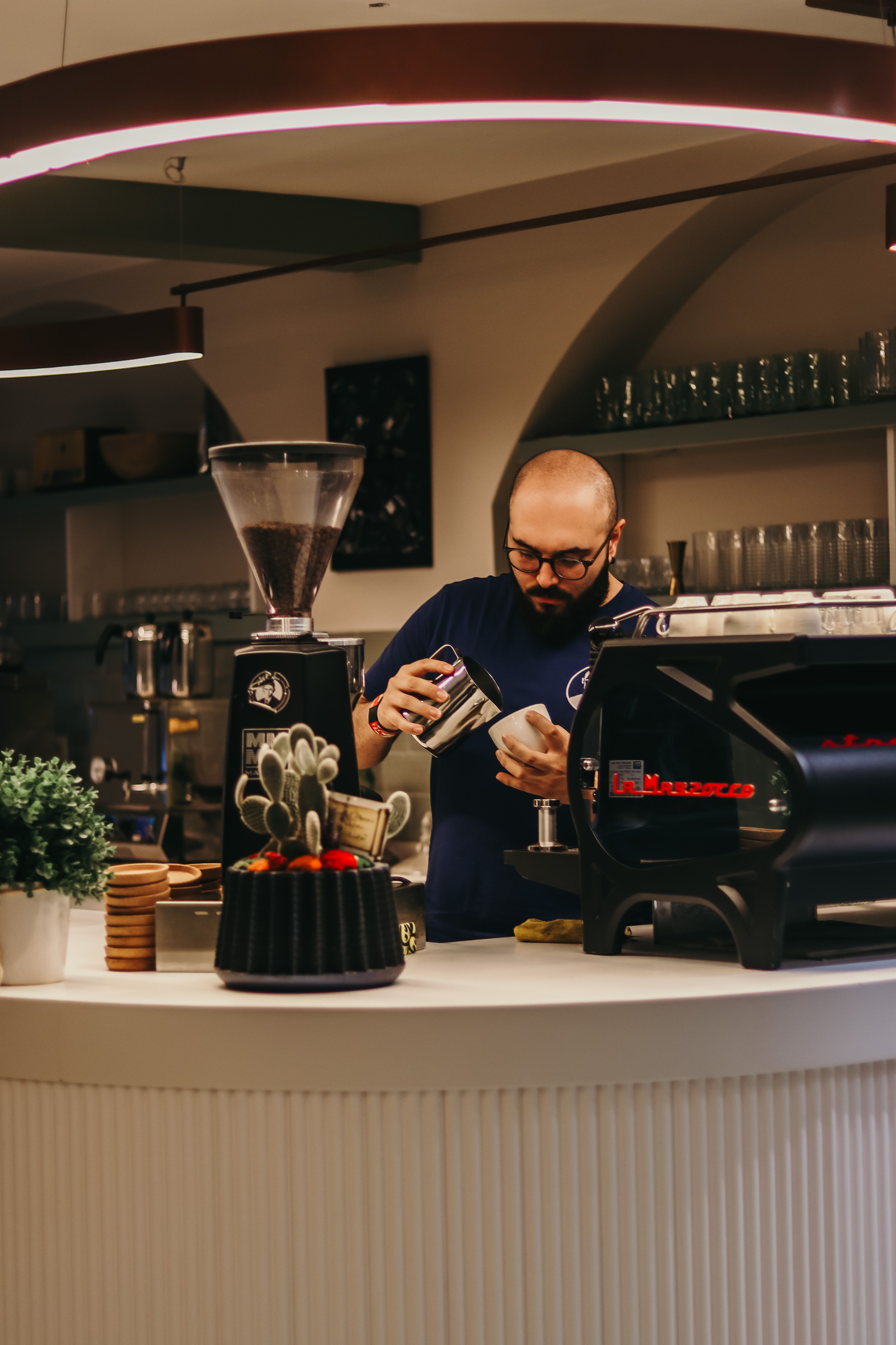 A Man Preparing Coffee in a Cafe · Free Stock Photo