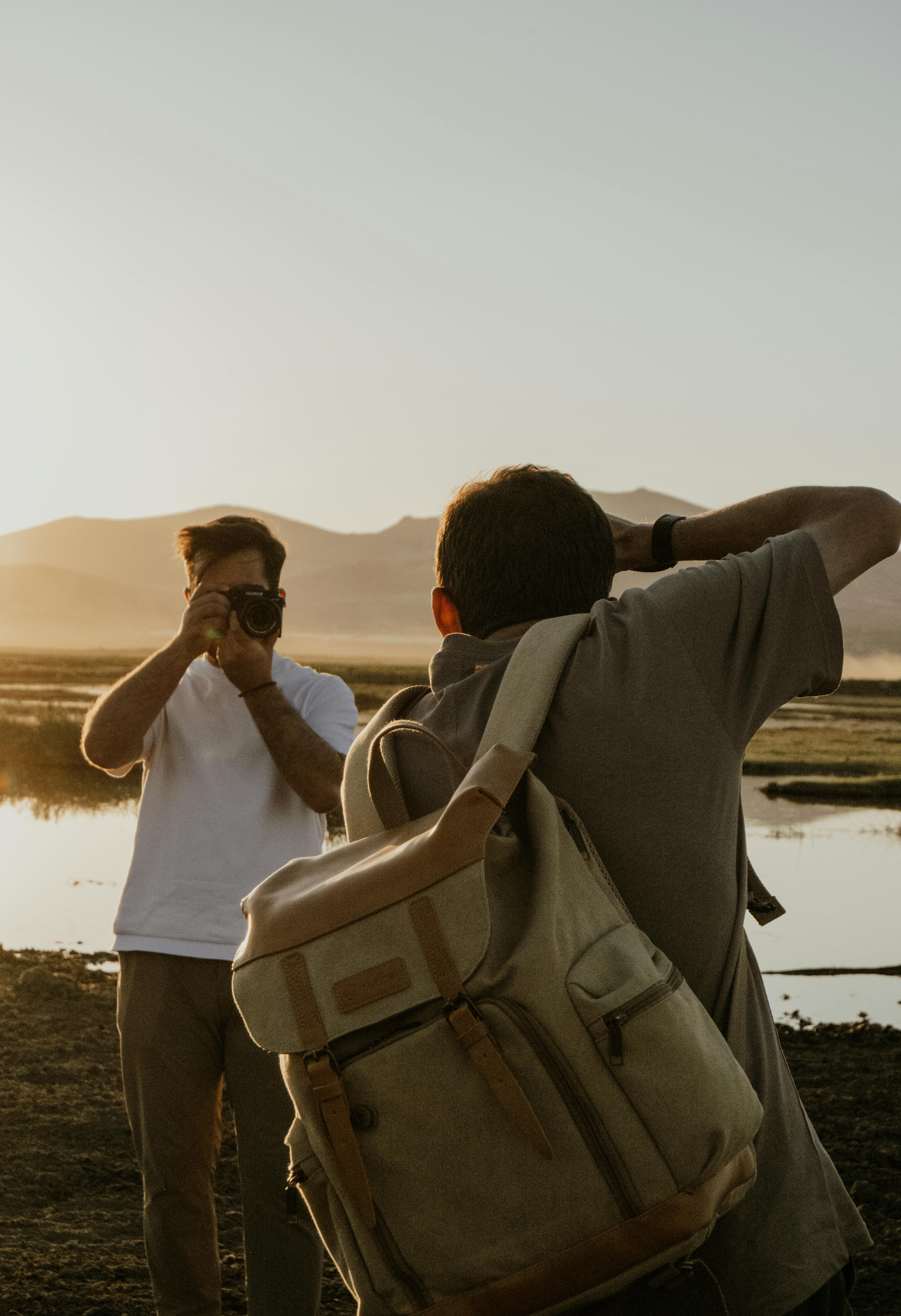 Men Taking Pictures Outside at Sunset · Free Stock Photo