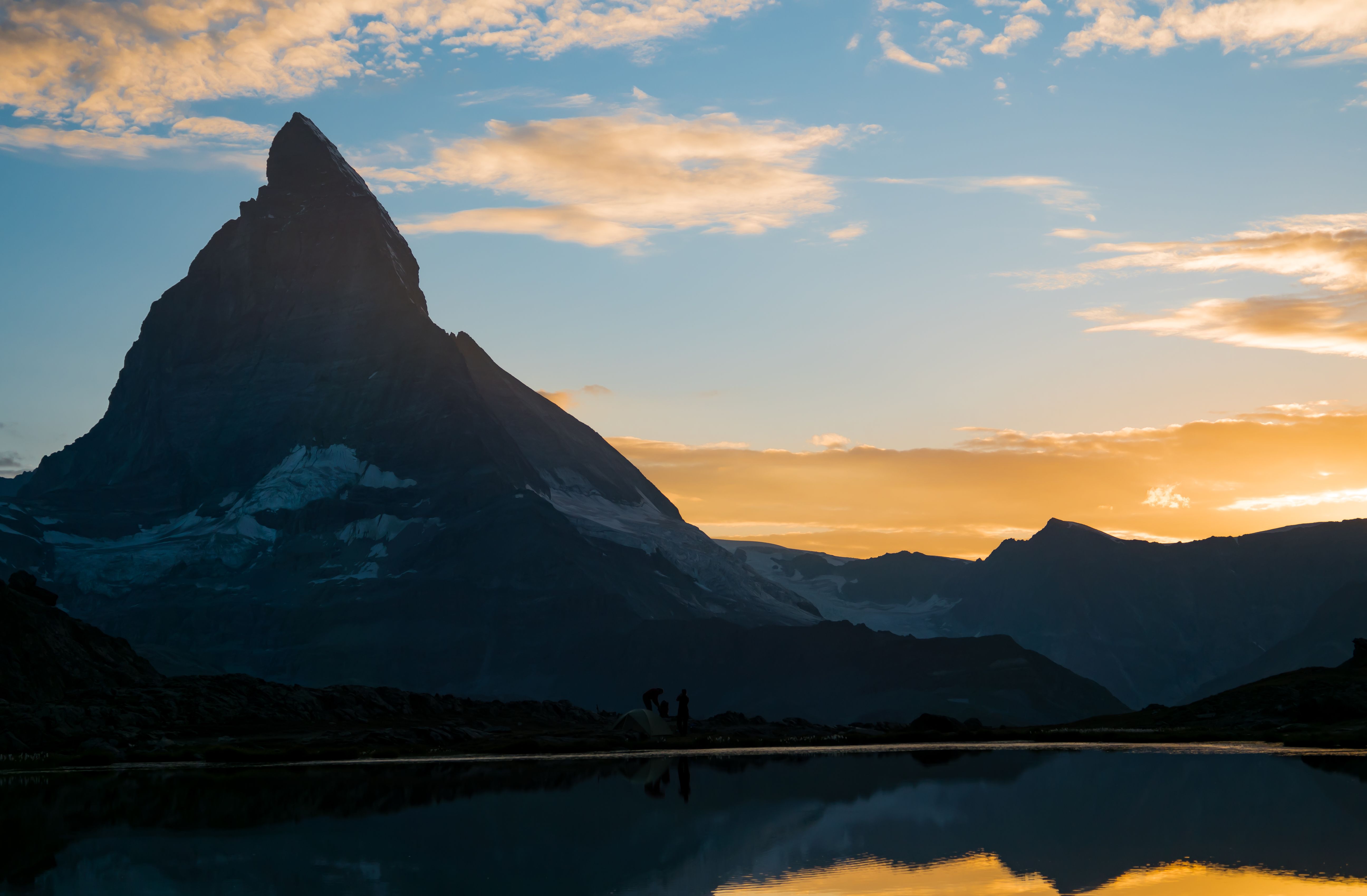 Photo of Person Standing Across the Mountain · Free Stock Photo