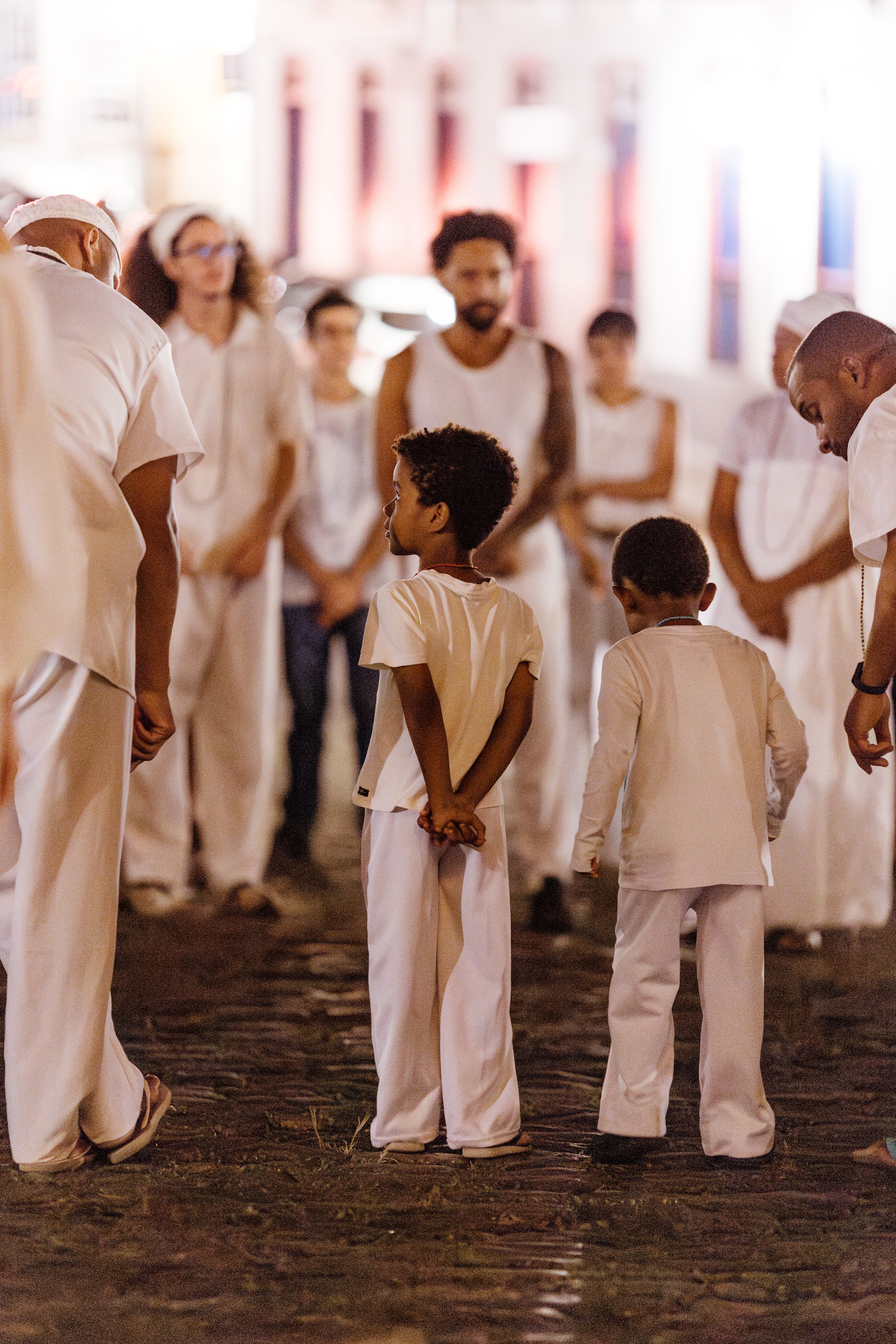 A Group of People in White Clothes Standing Outside · Free Stock Photo