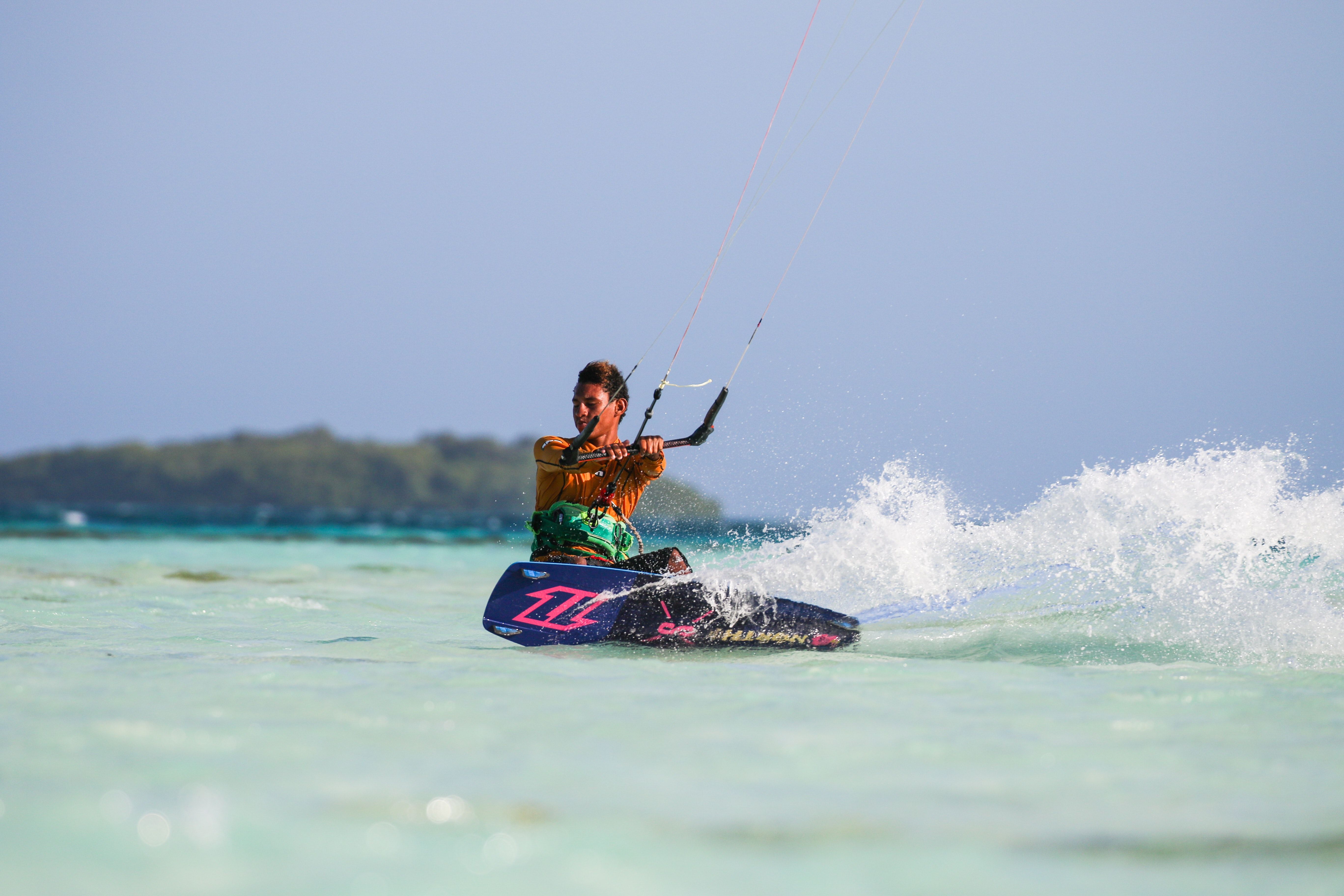 Man Kitesurfing on Waves on Sea Shore · Free Stock Photo