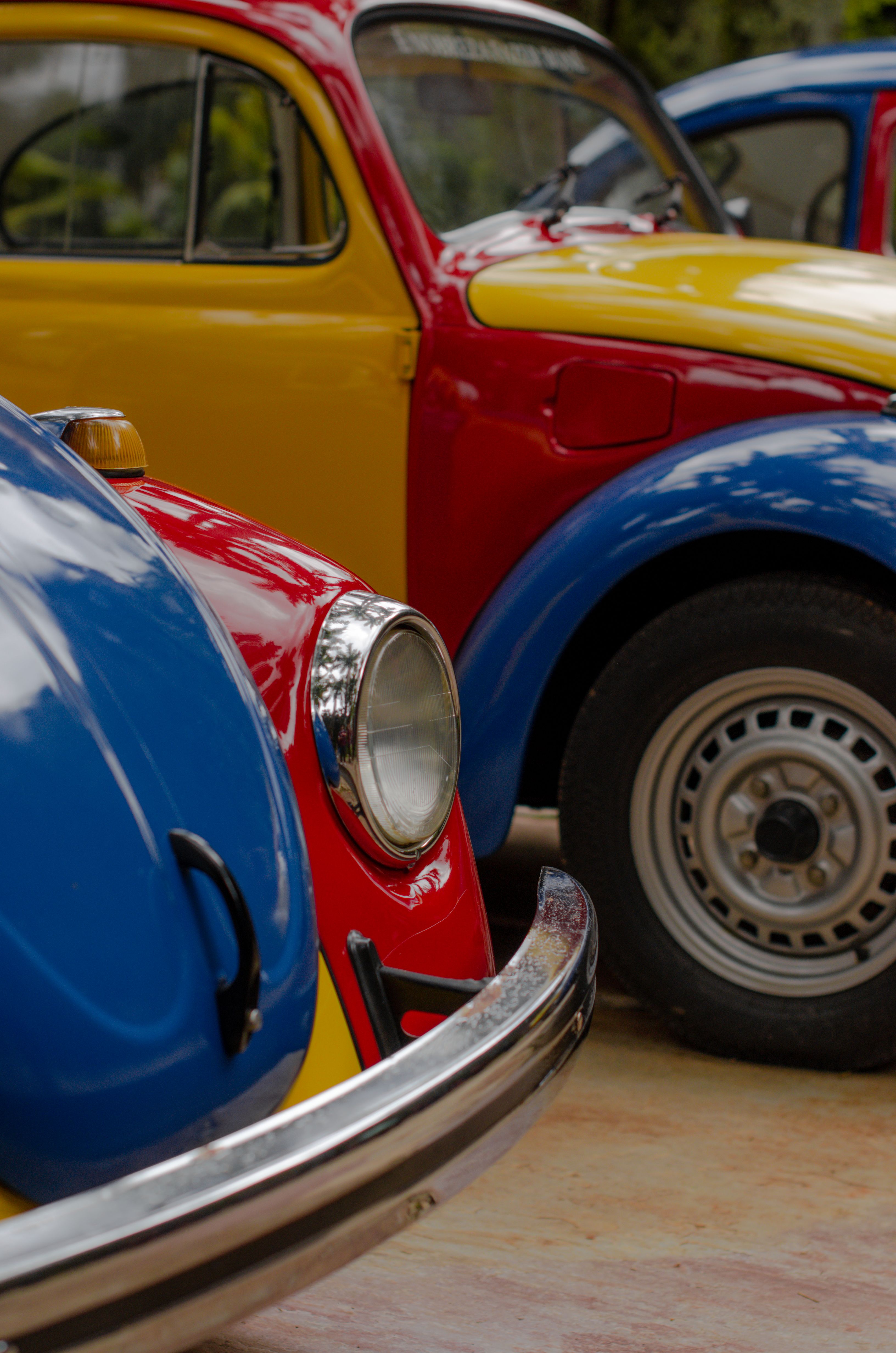 Colorful Vintage Car on a Parking Lot · Free Stock Photo