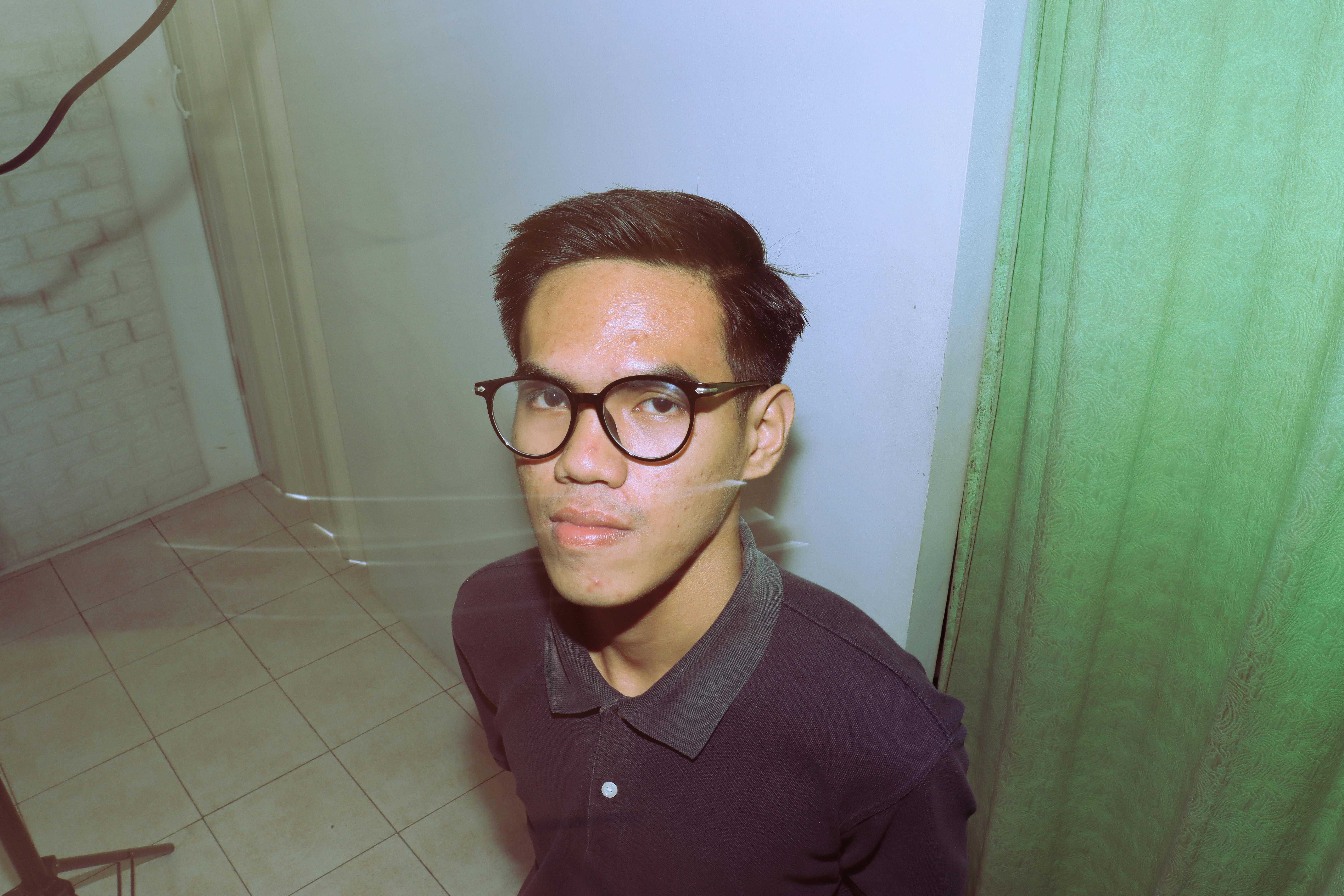 Stern Face of Brunette in Eyeglasses · Free Stock Photo