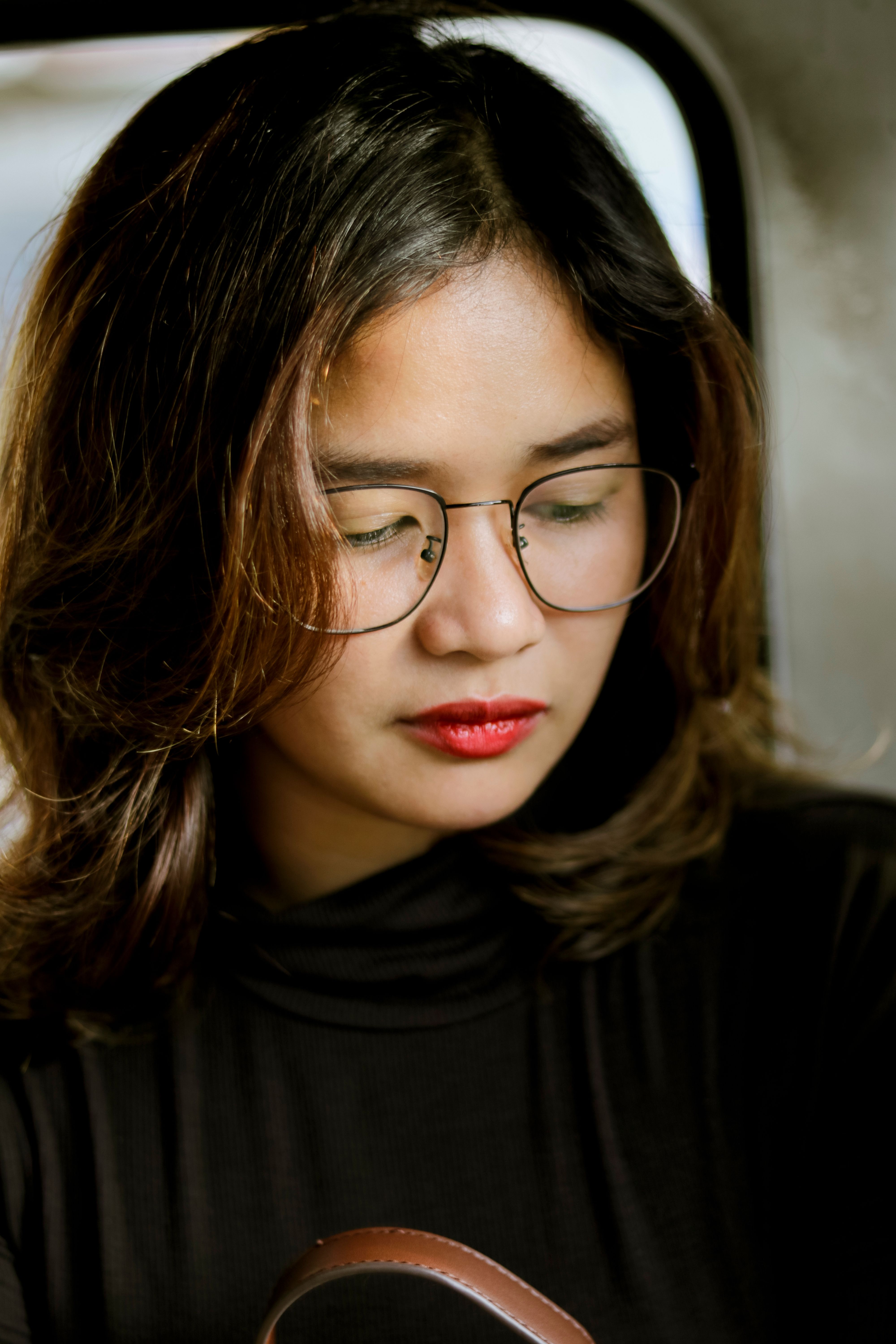Model Wearing Red Lipstick Posing with Red Rose · Free Stock Photo