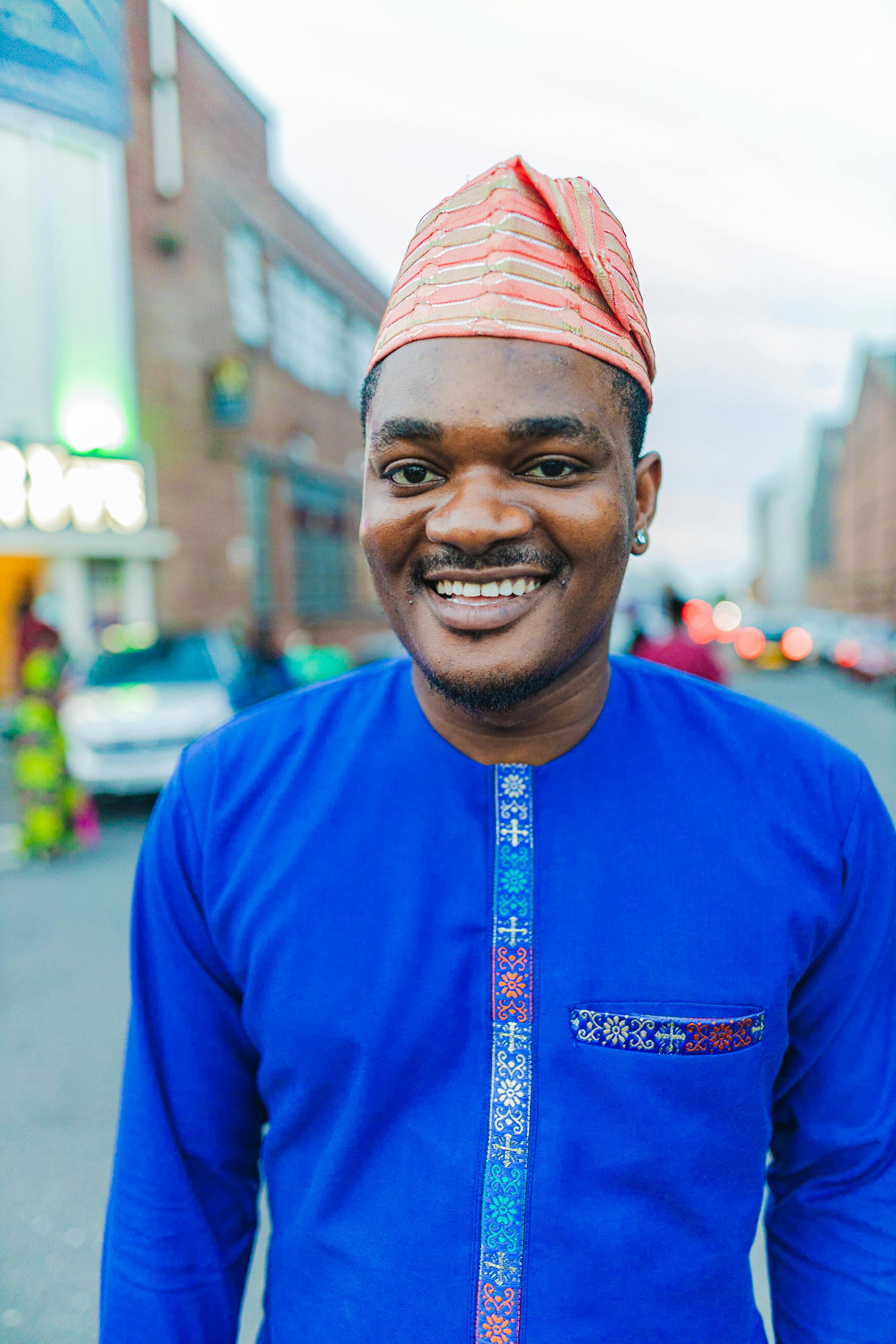 Smiling Man in Traditional Clothing · Free Stock Photo