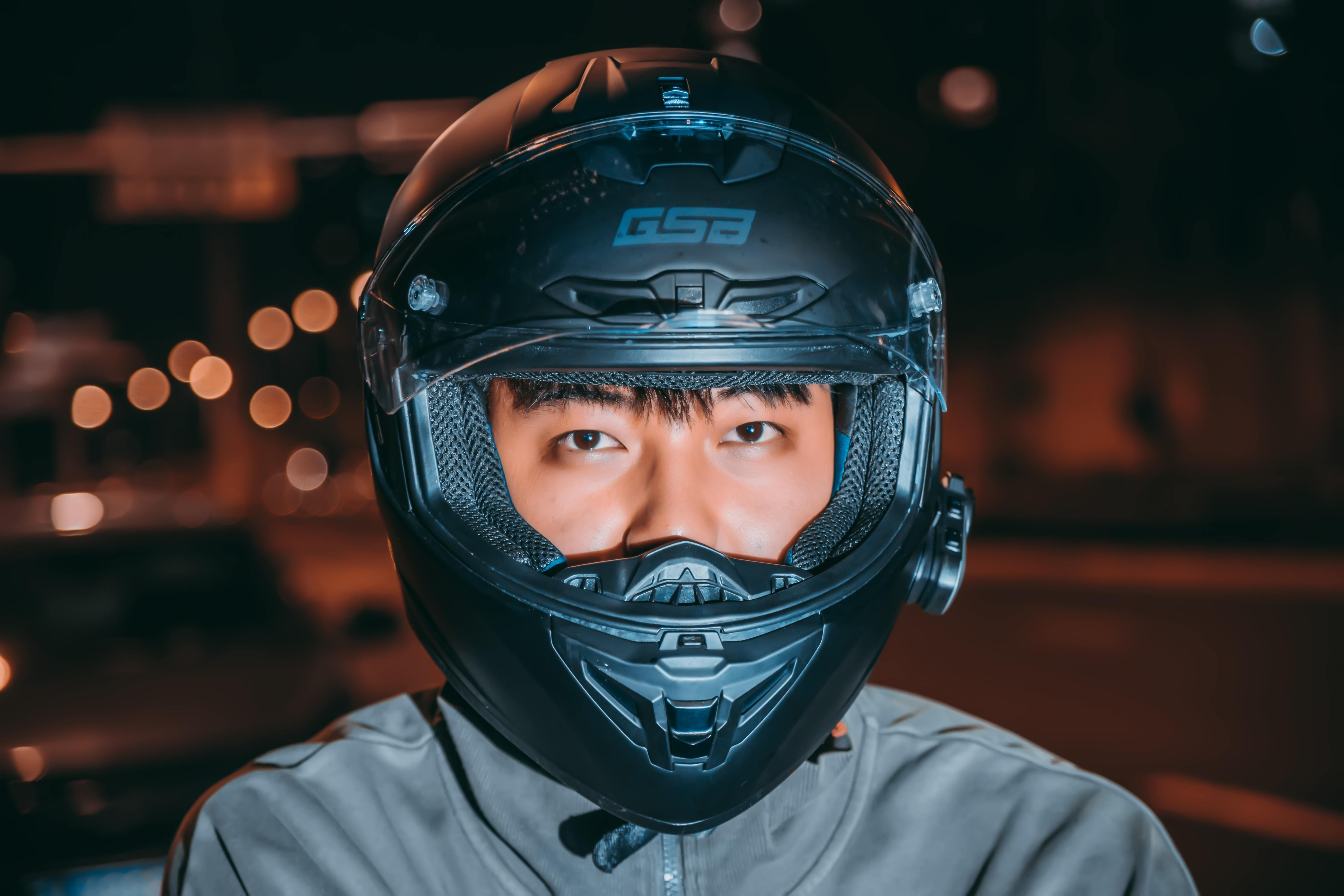 Man in Motorcycle Helmet at Night · Free Stock Photo