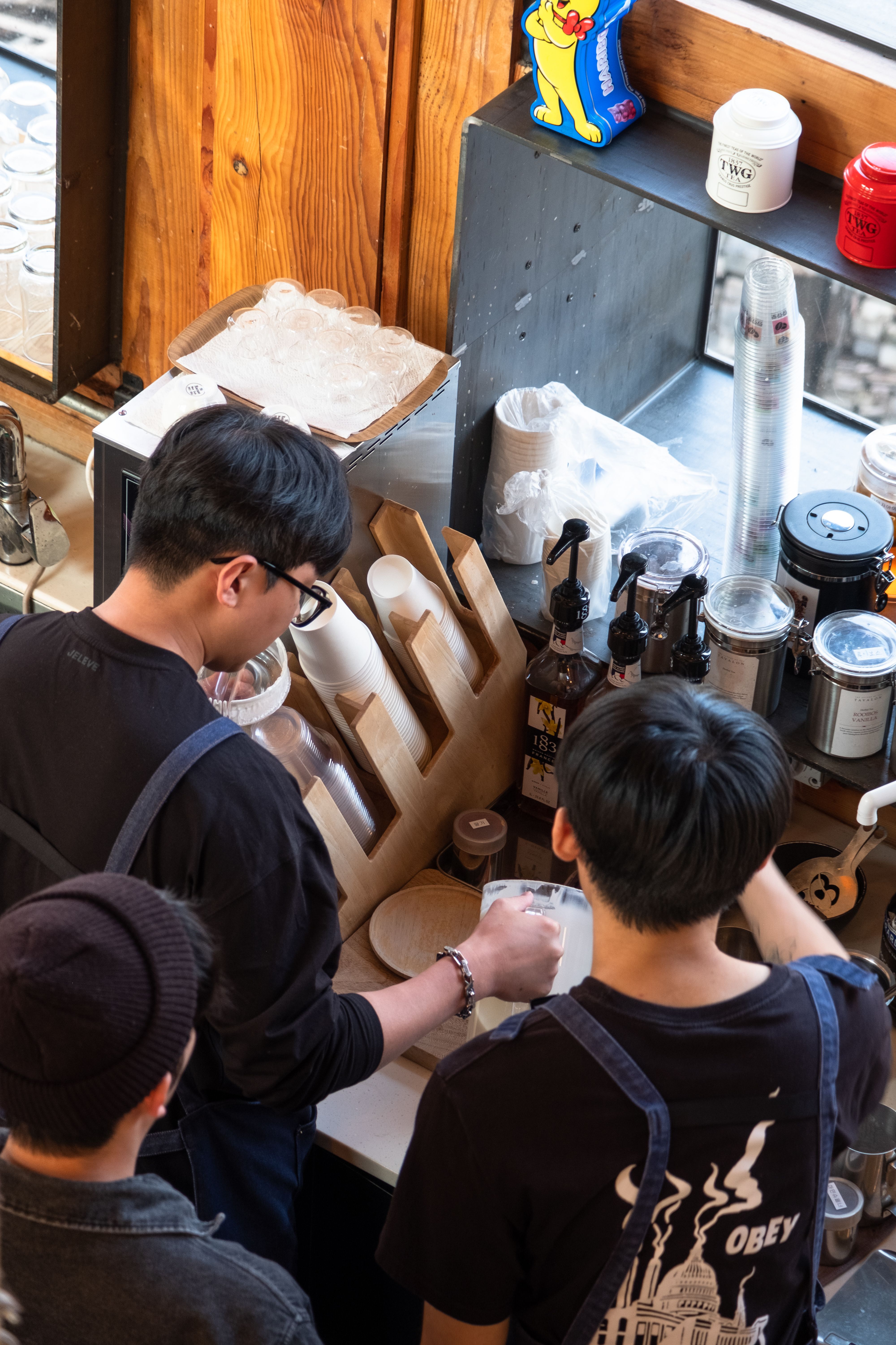 A Group of Young Men Making Coffee · Free Stock Photo