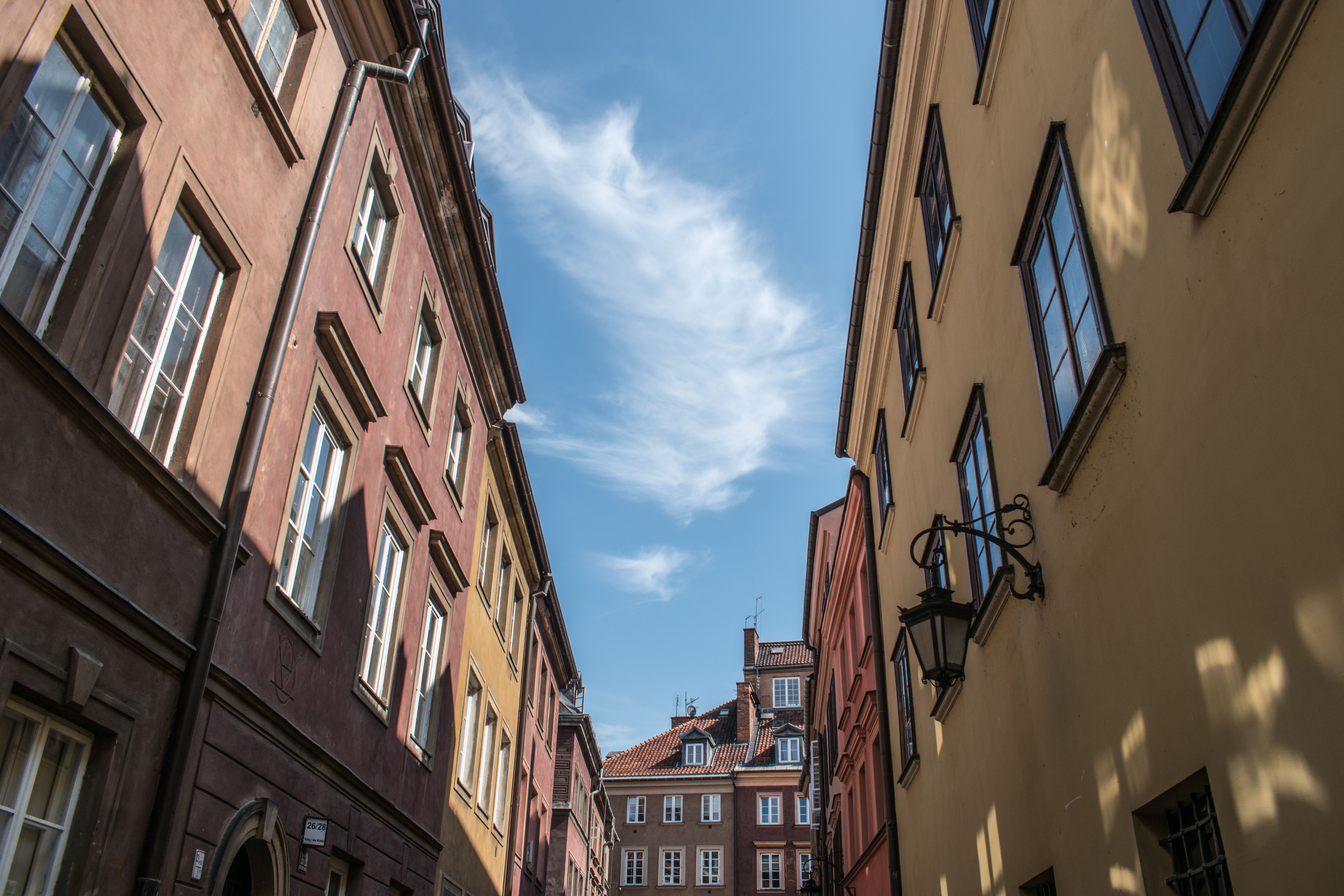 Alleyway with an Old Wooden Building · Free Stock Photo