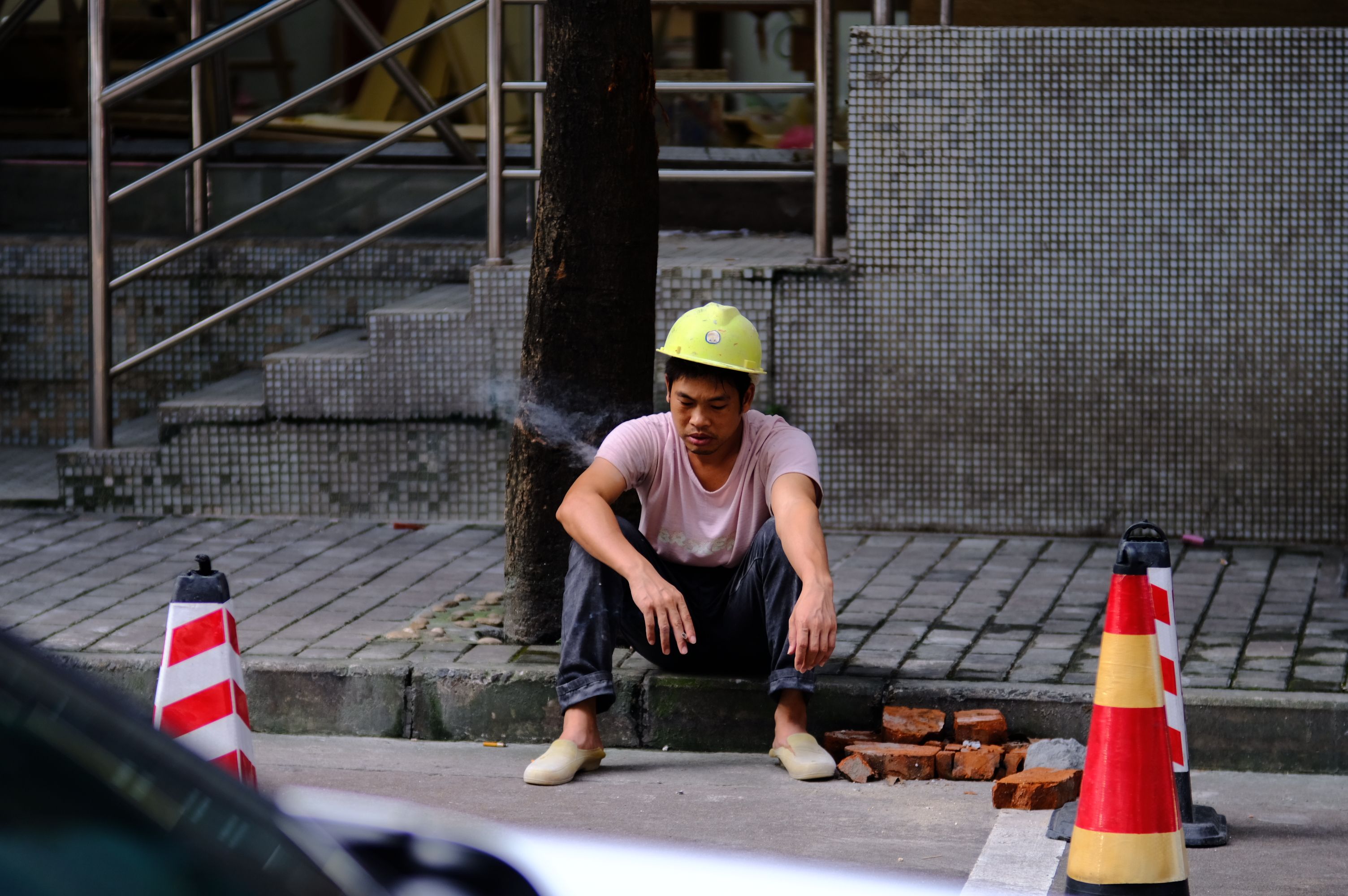 Worker Resting on Street · Free Stock Photo