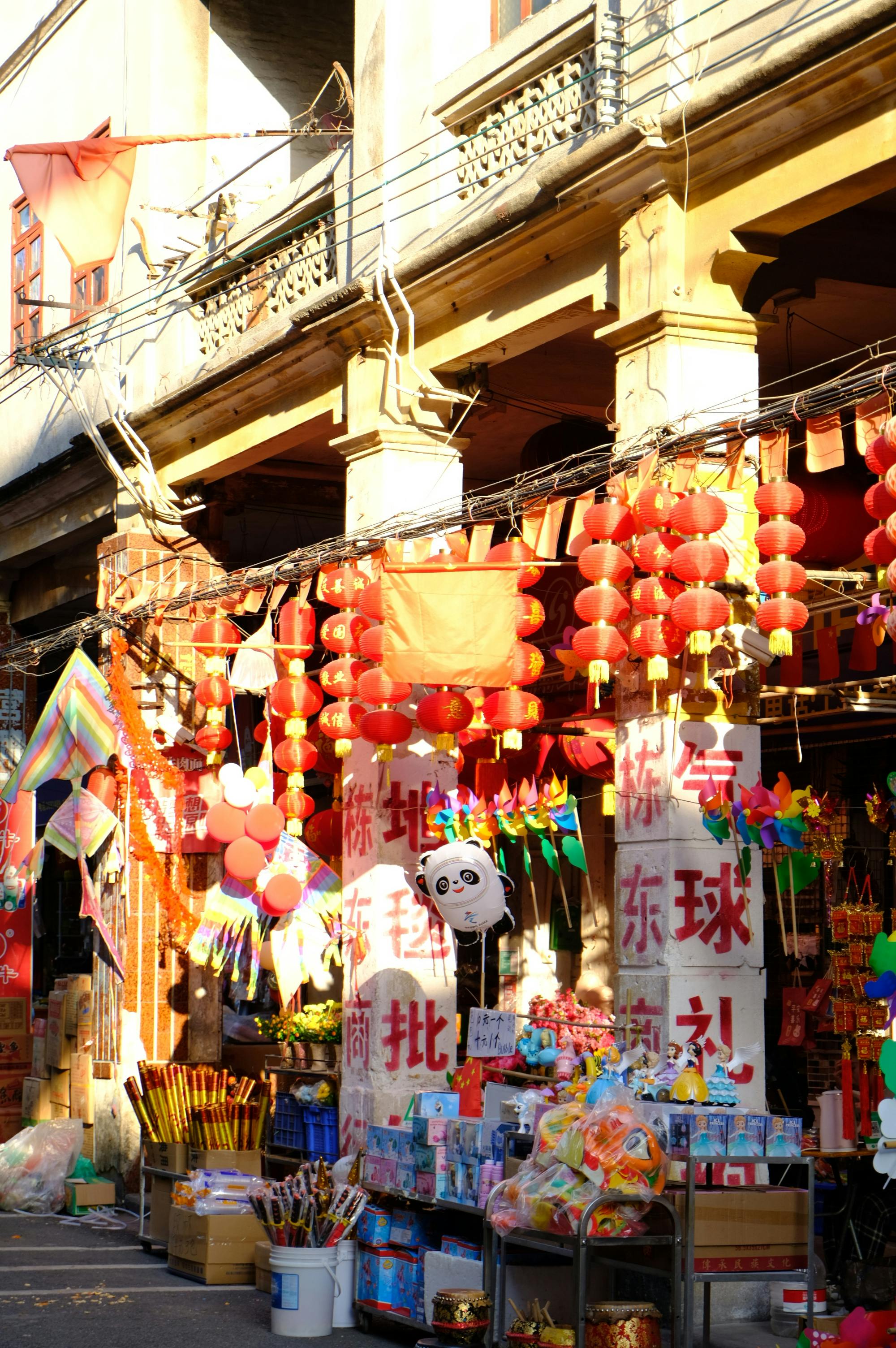 Red Lanterns Hanging over Stall on Street · Free Stock Photo