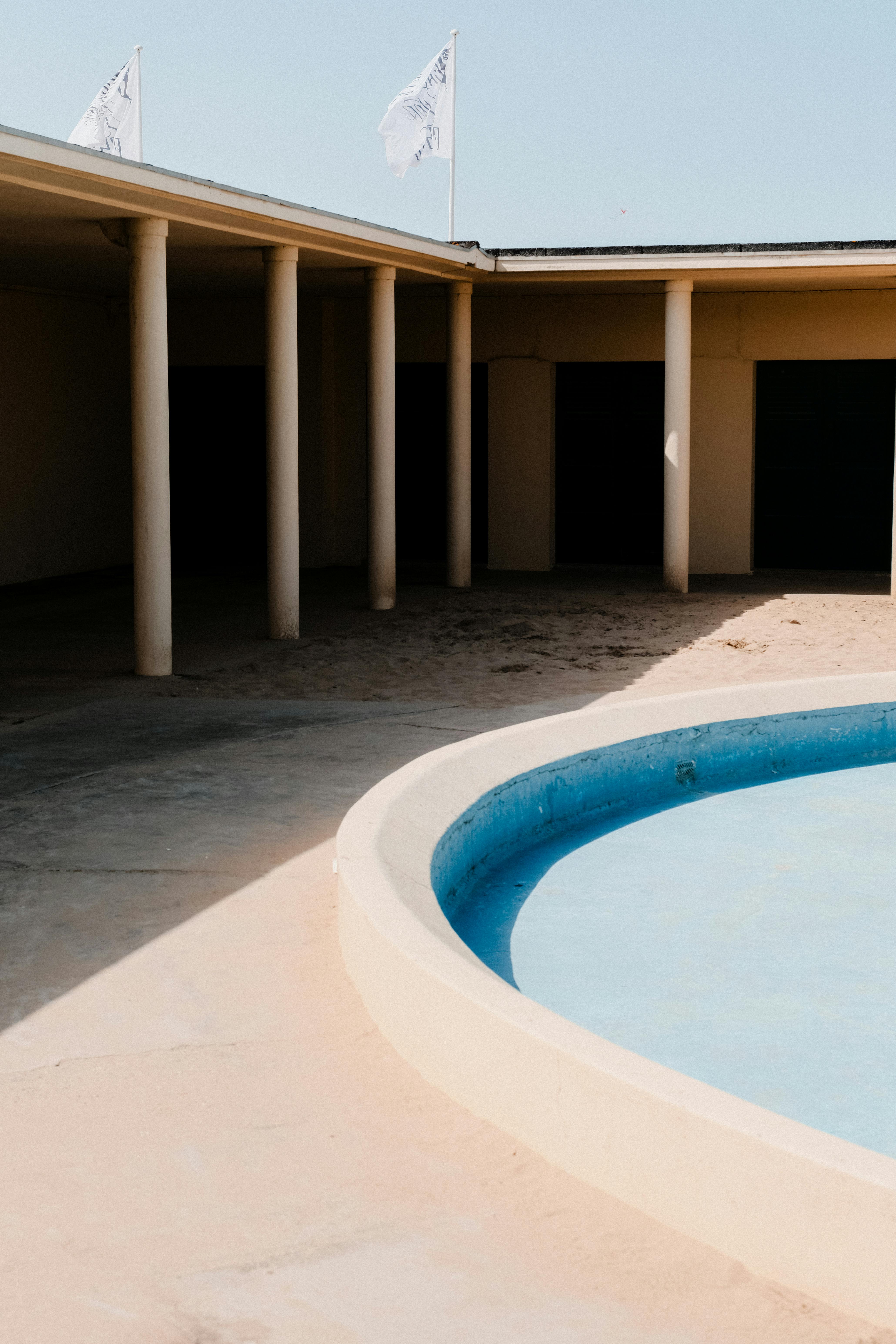 Abandoned Building with Empty Fountain Pool · Free Stock Photo