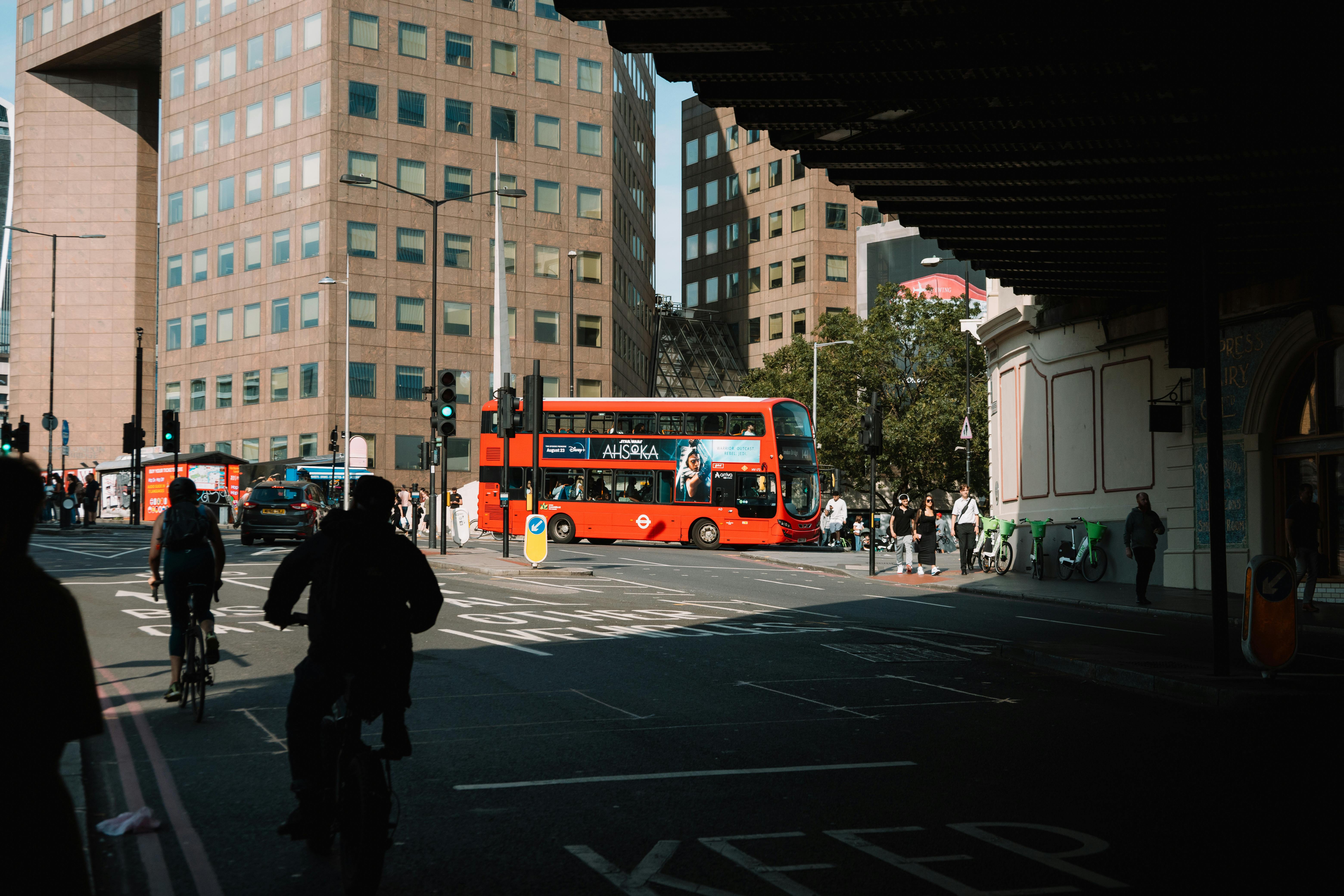 Red London Bus Running on Street · Free Stock Photo