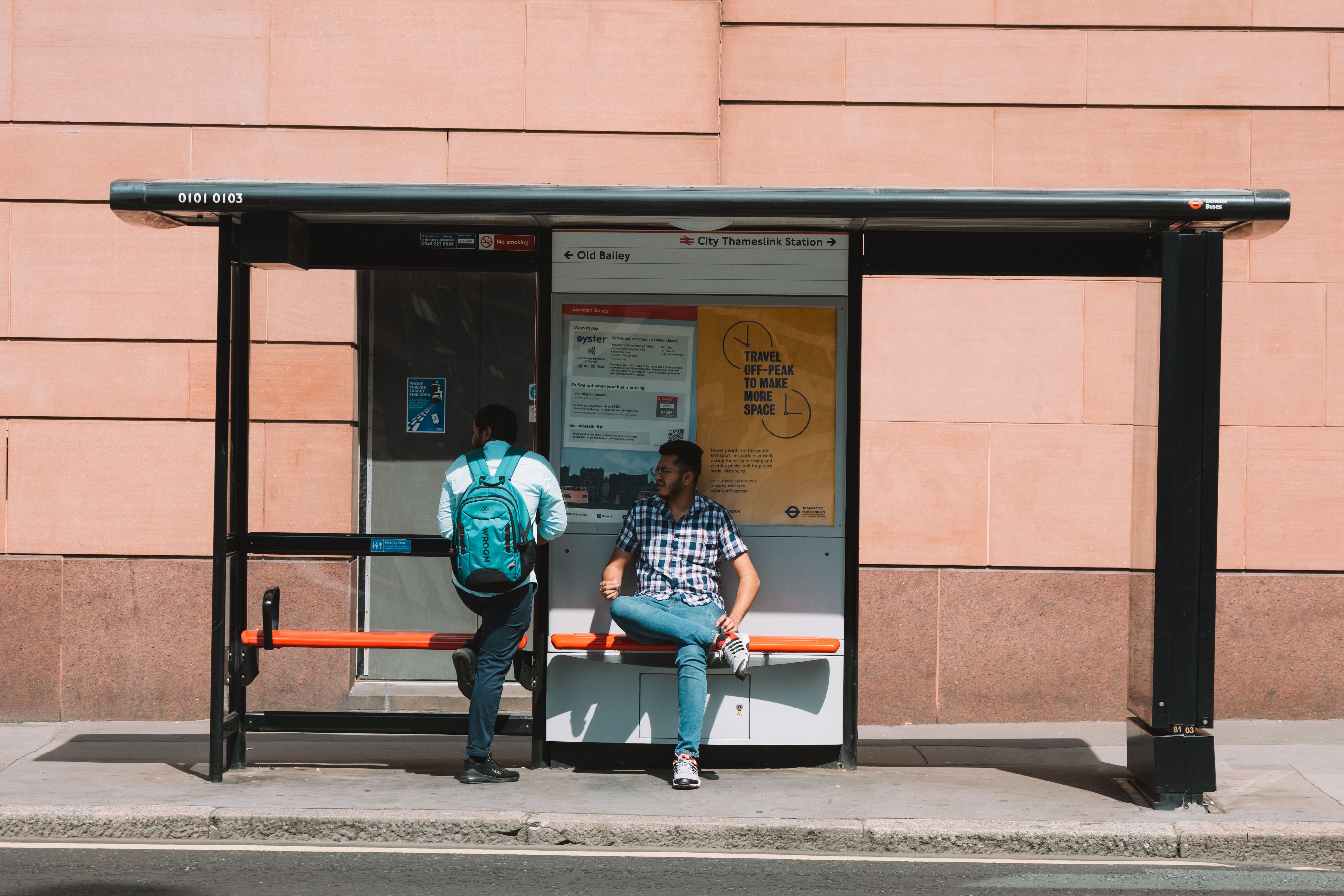 Men Waiting on Bus Stop in London · Free Stock Photo