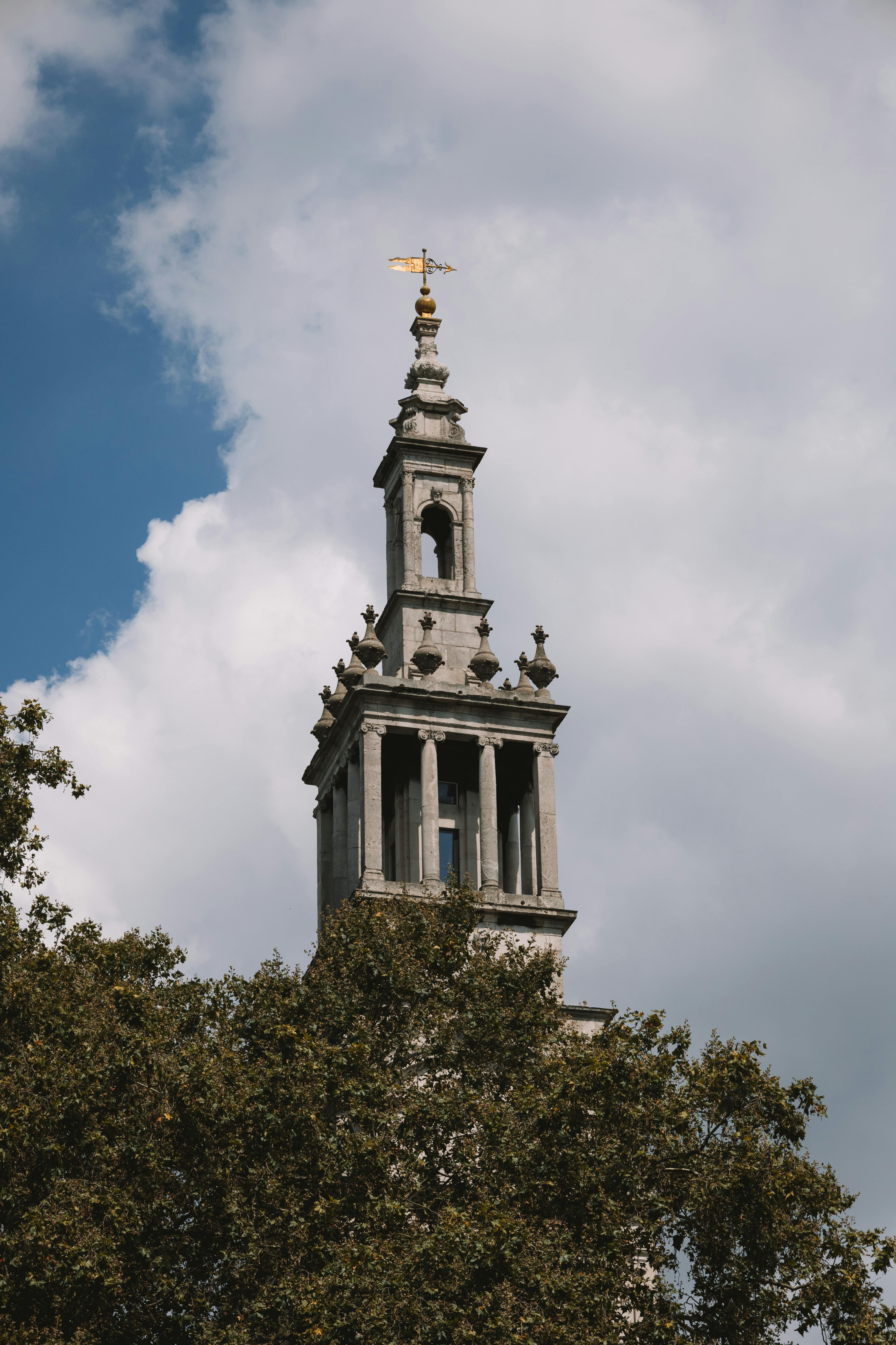 Decorative Spiky Tower against a Clouded Sky · Free Stock Photo