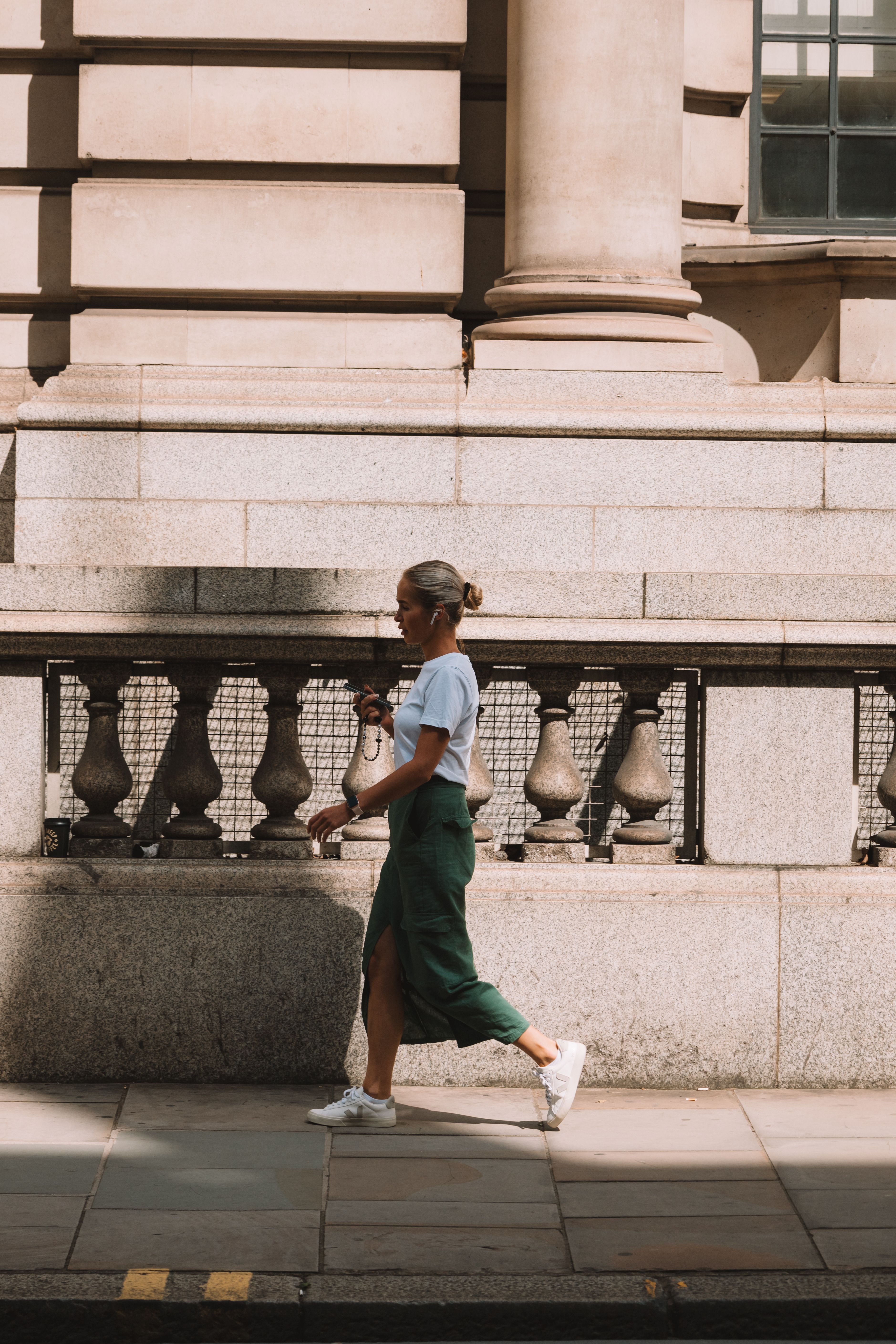 Woman Walking on a Street in Summer · Free Stock Photo
