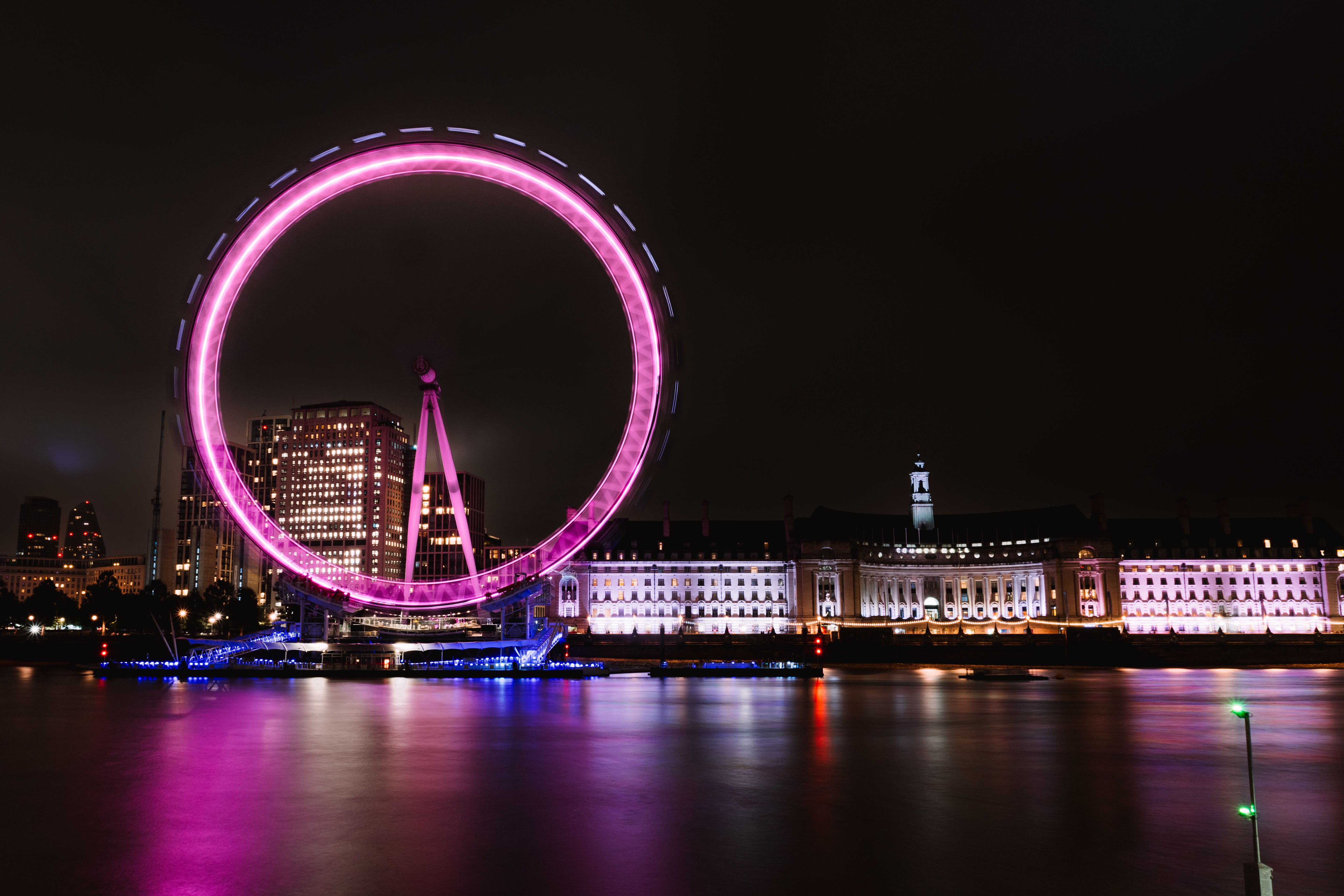 Pink Illuminated Ferris Wheel by the River at Night · Free Stock Photo