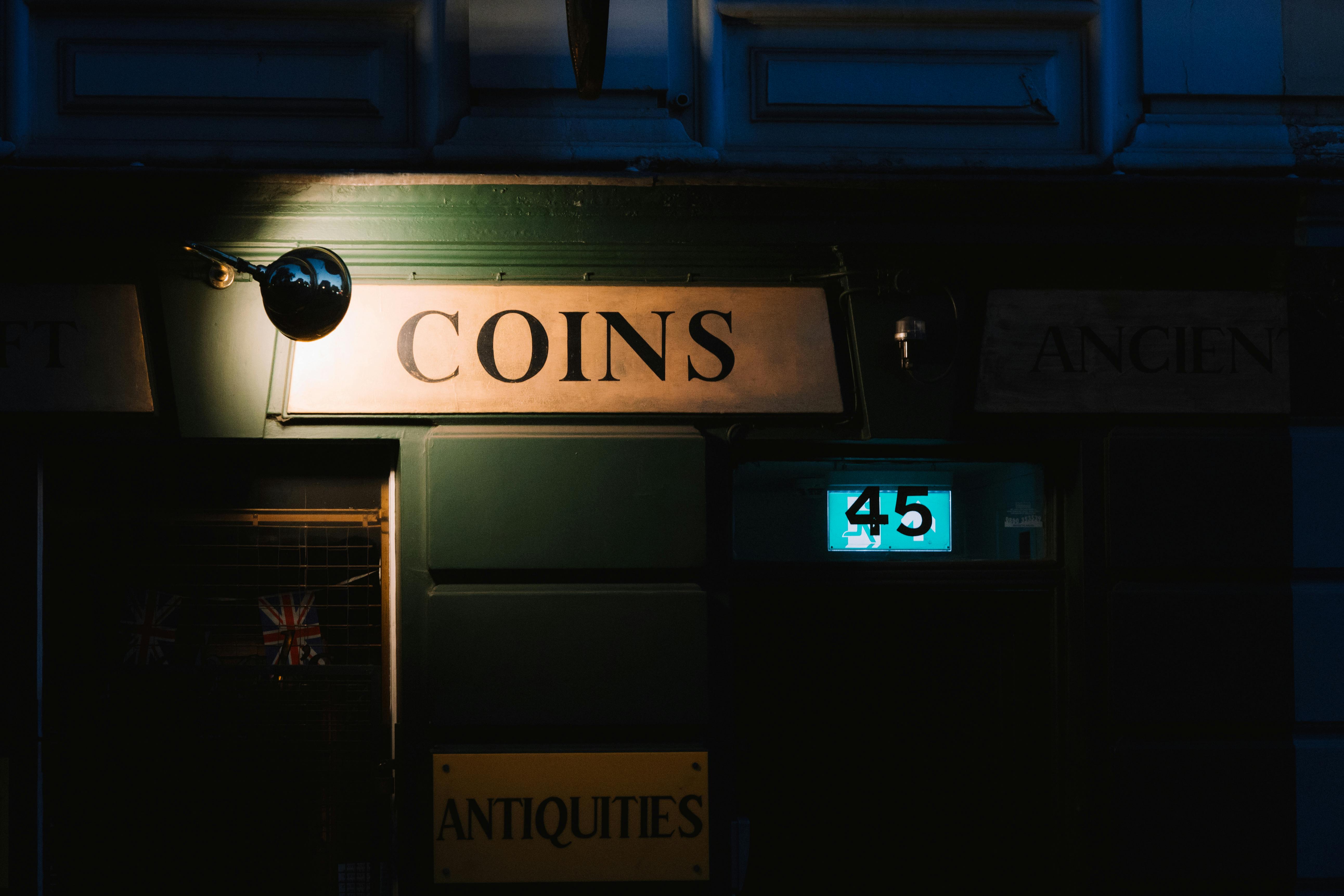 Illuminated Vintage Shop Sign at Night · Free Stock Photo
