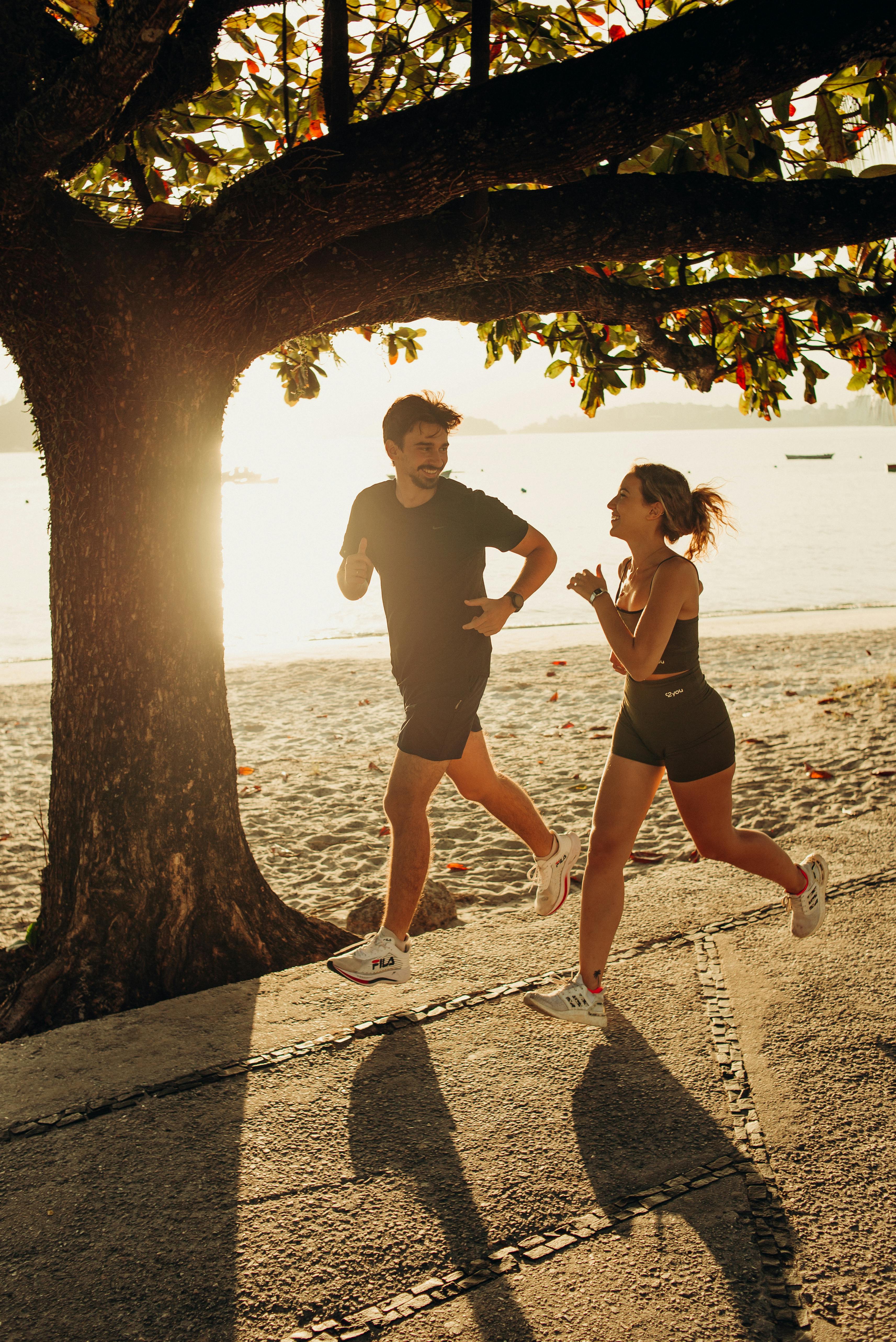 Couple of Runners on Beach · Free Stock Photo