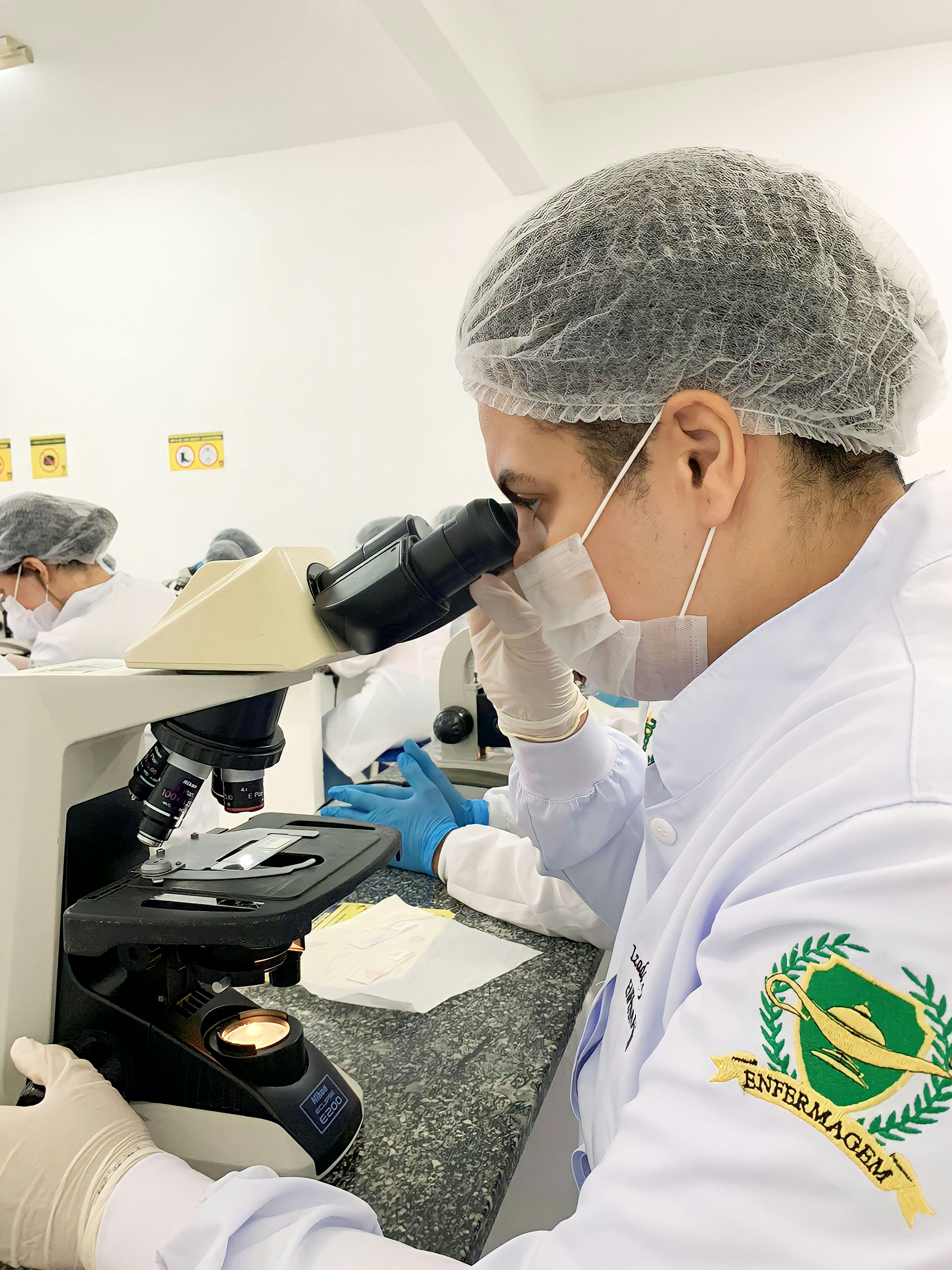 Person Looking in Microscope · Free Stock Photo