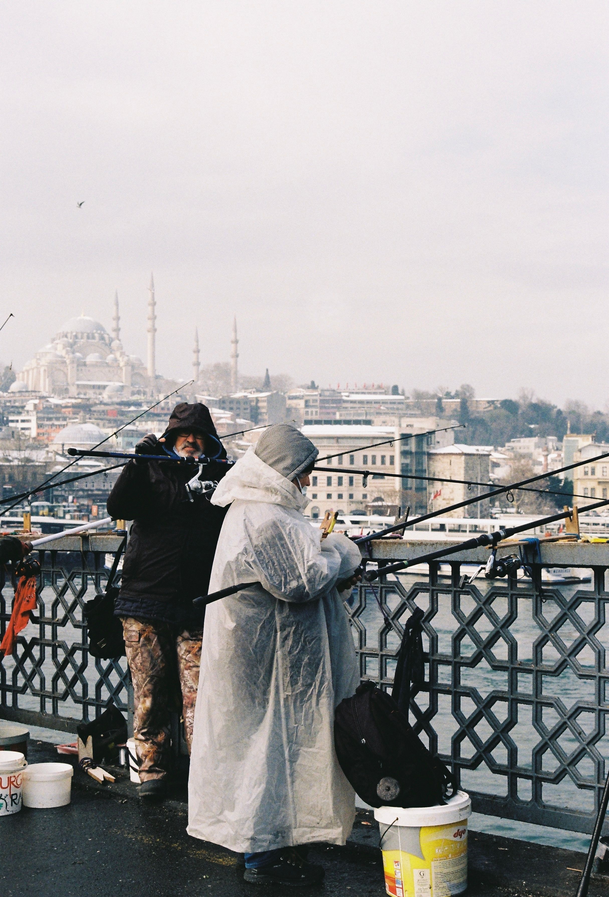 People Fishing on Bridge over River · Free Stock Photo