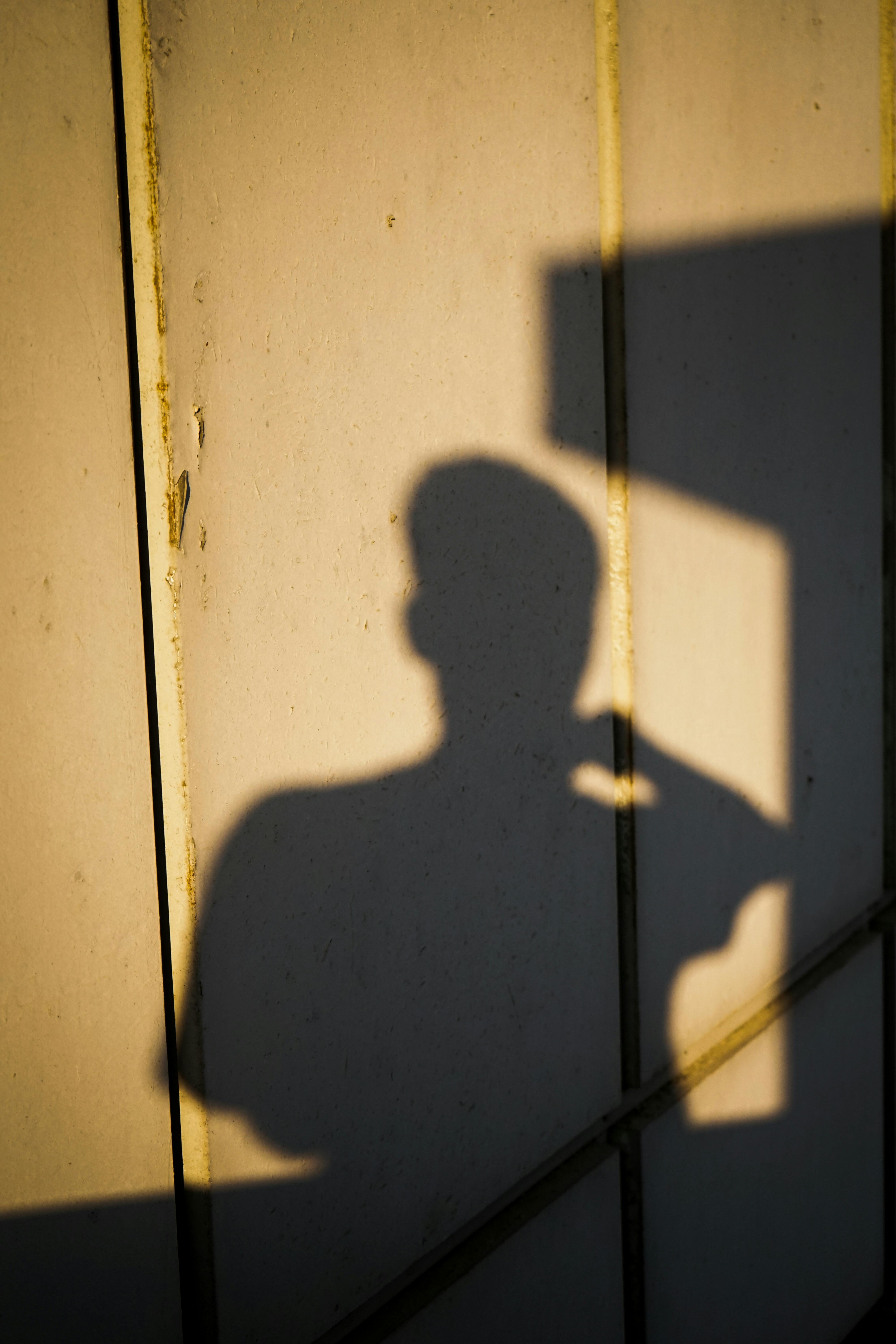 Shadow of Person Standing by Wall · Free Stock Photo
