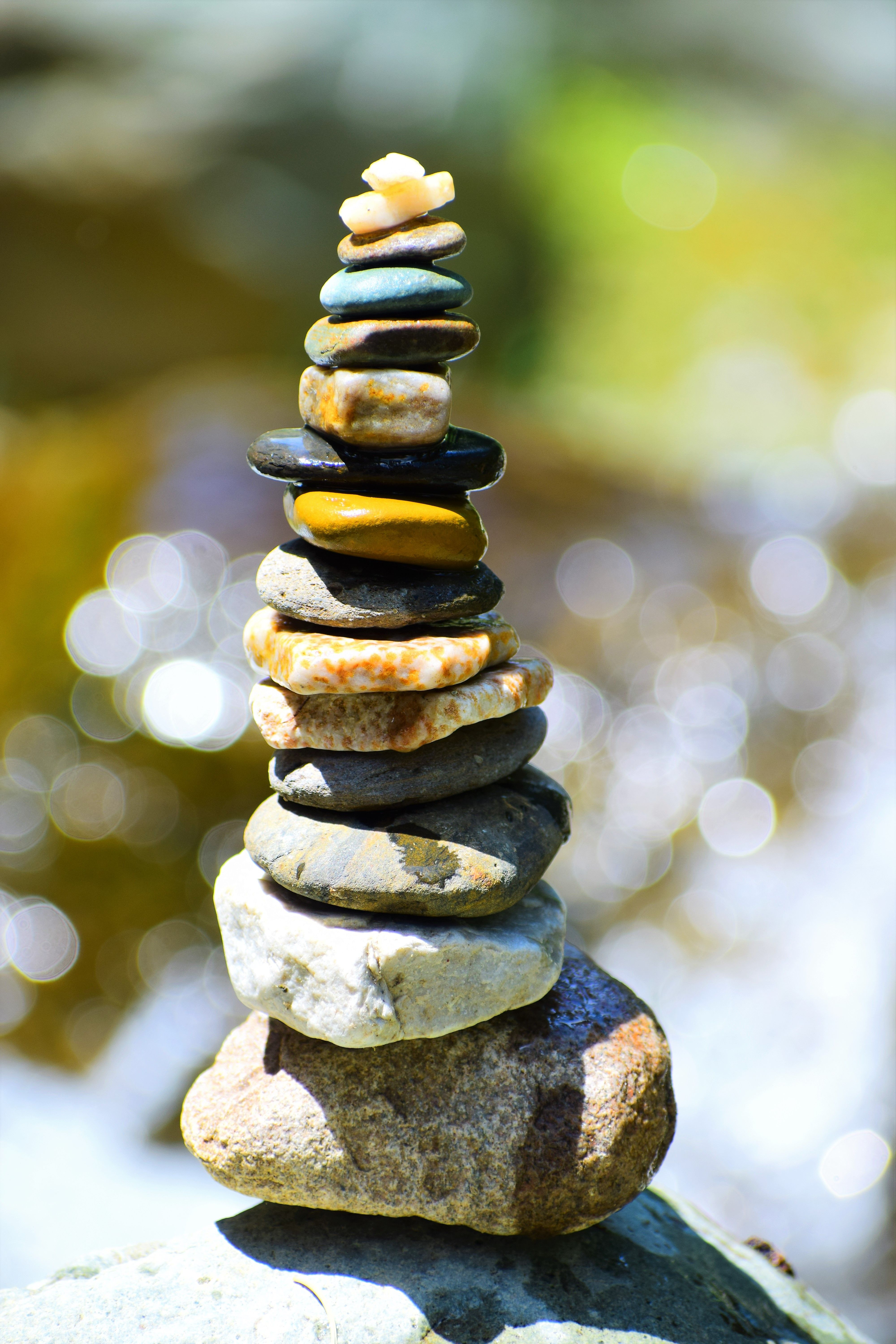 Woman Hands Putting Stones on Heap · Free Stock Photo