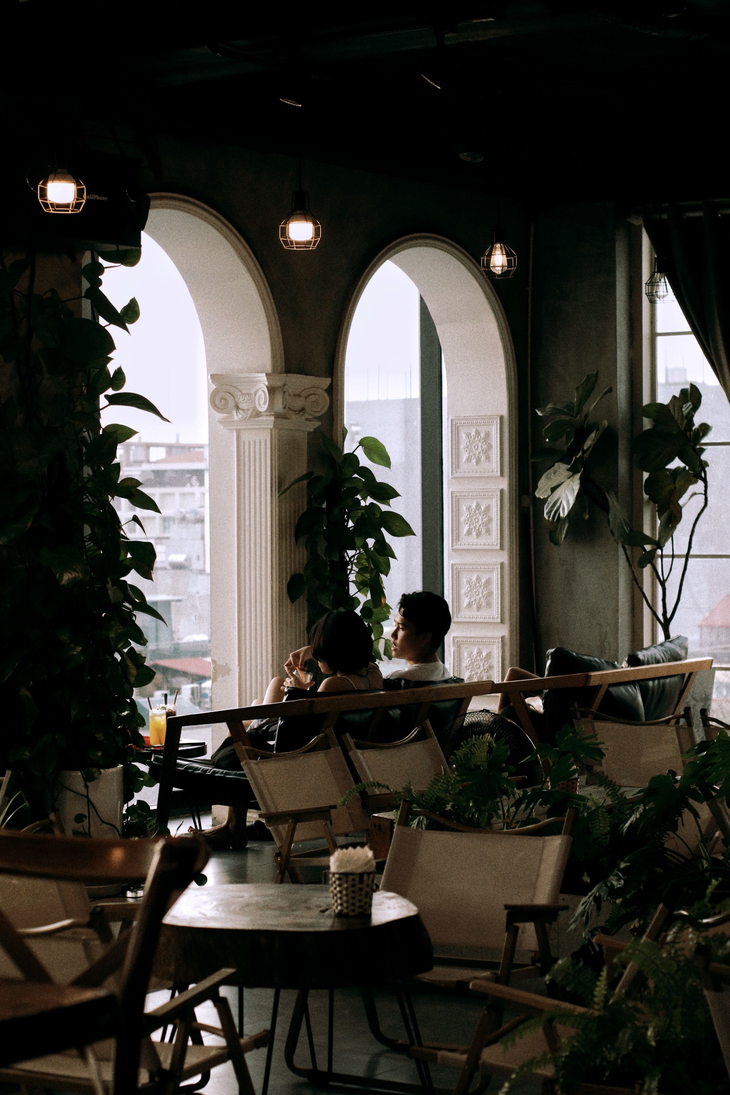 Woman and Man Sitting near Windows · Free Stock Photo