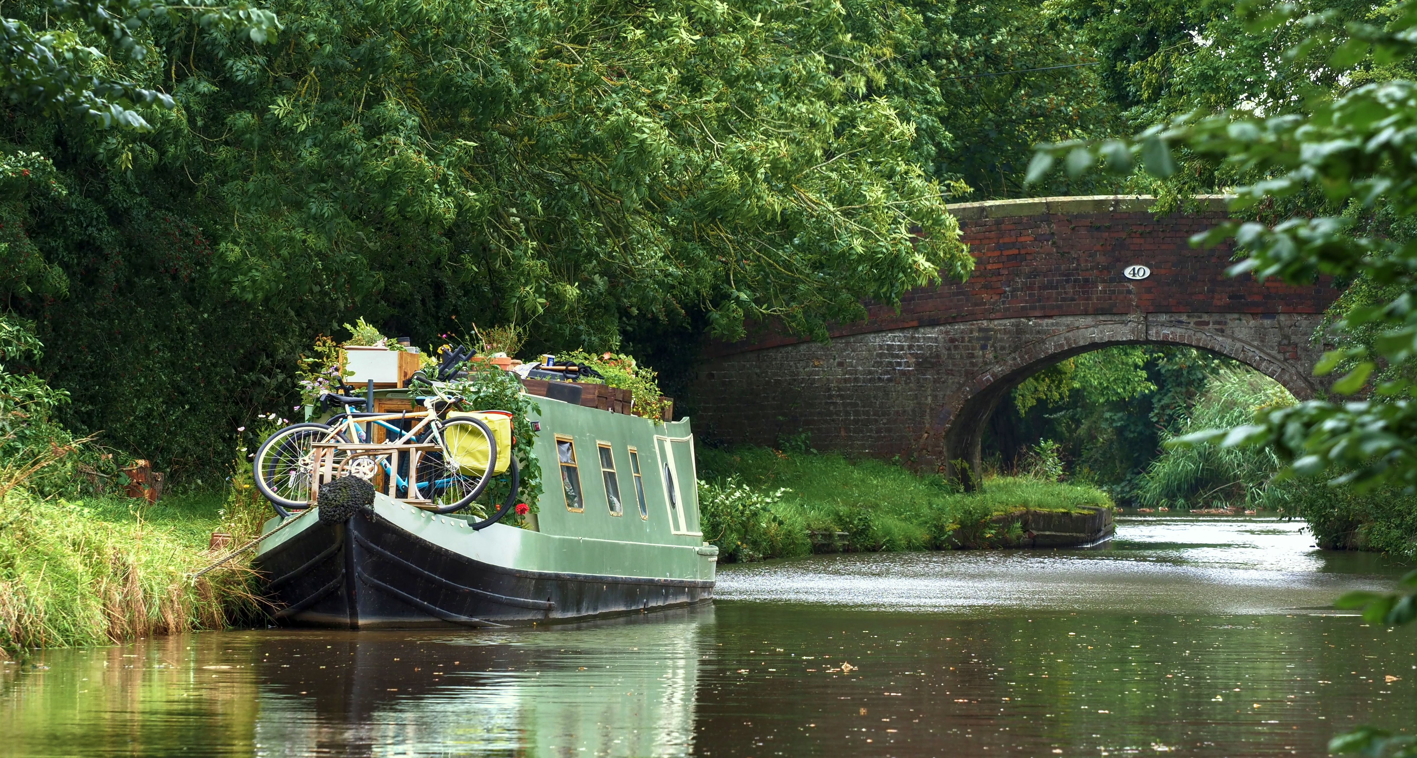Barge with Bicycle on River in Forest · Free Stock Photo