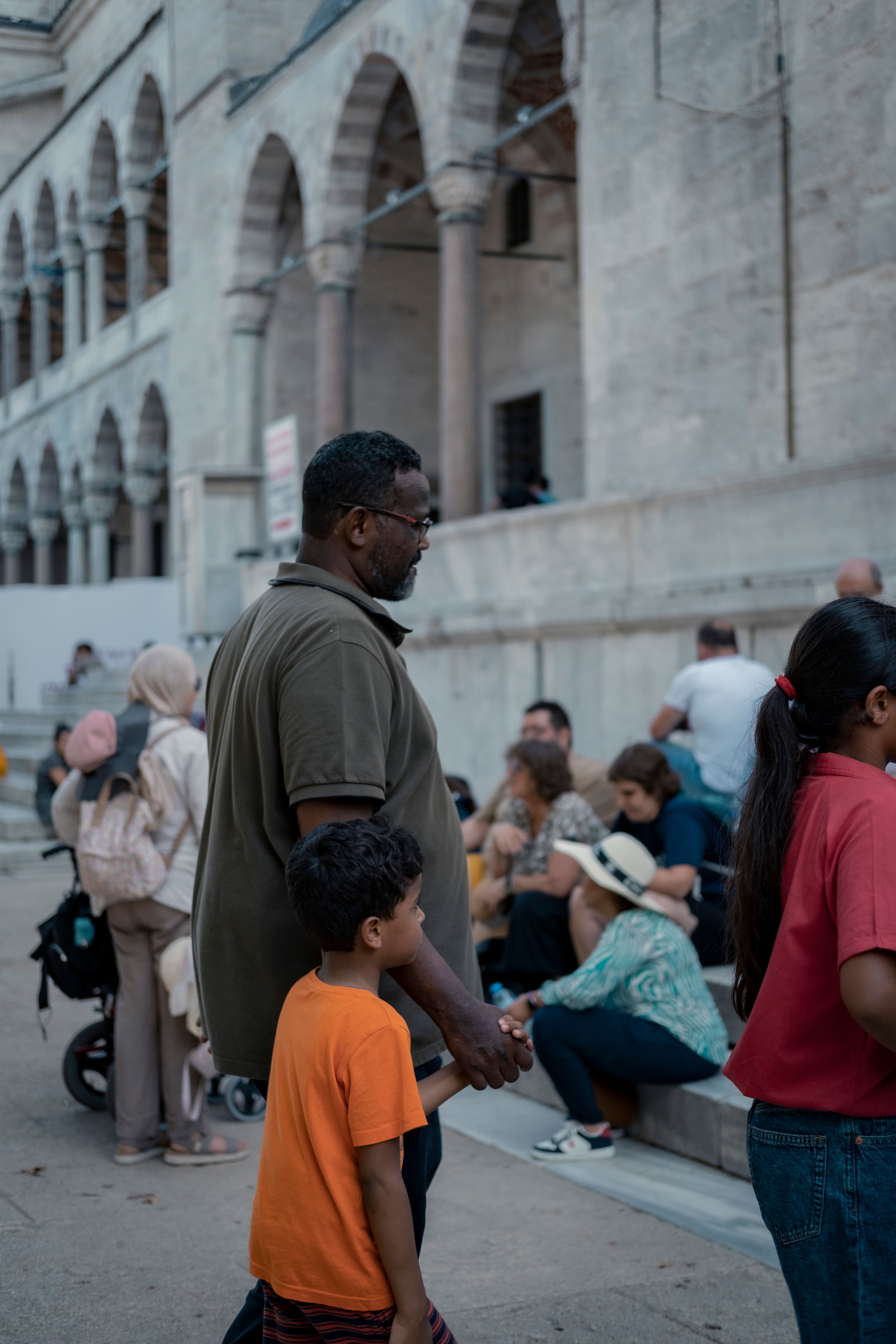 Father with Son among People near Building · Free Stock Photo