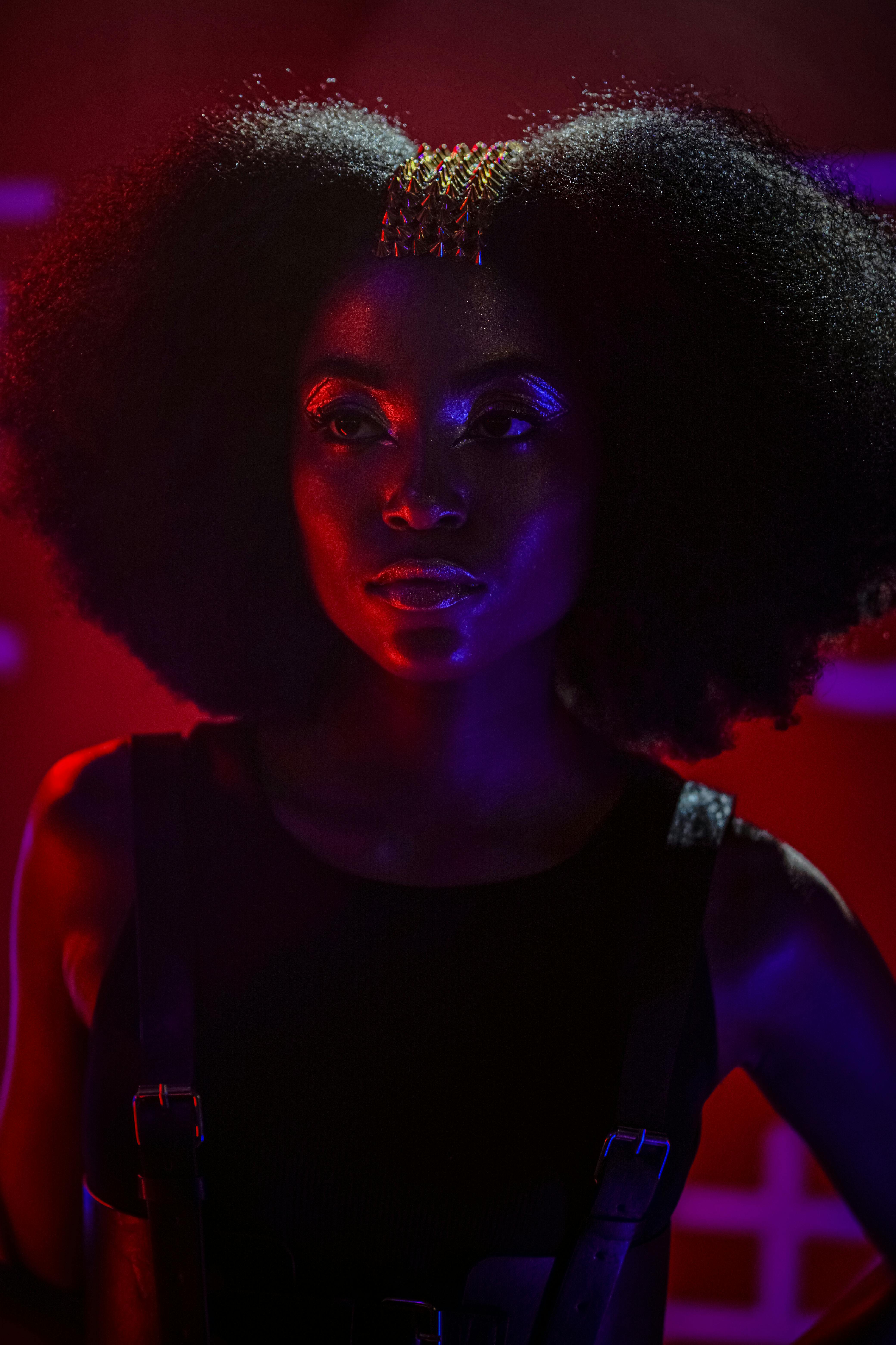 Portrait of a Woman in Dark Red Light · Free Stock Photo