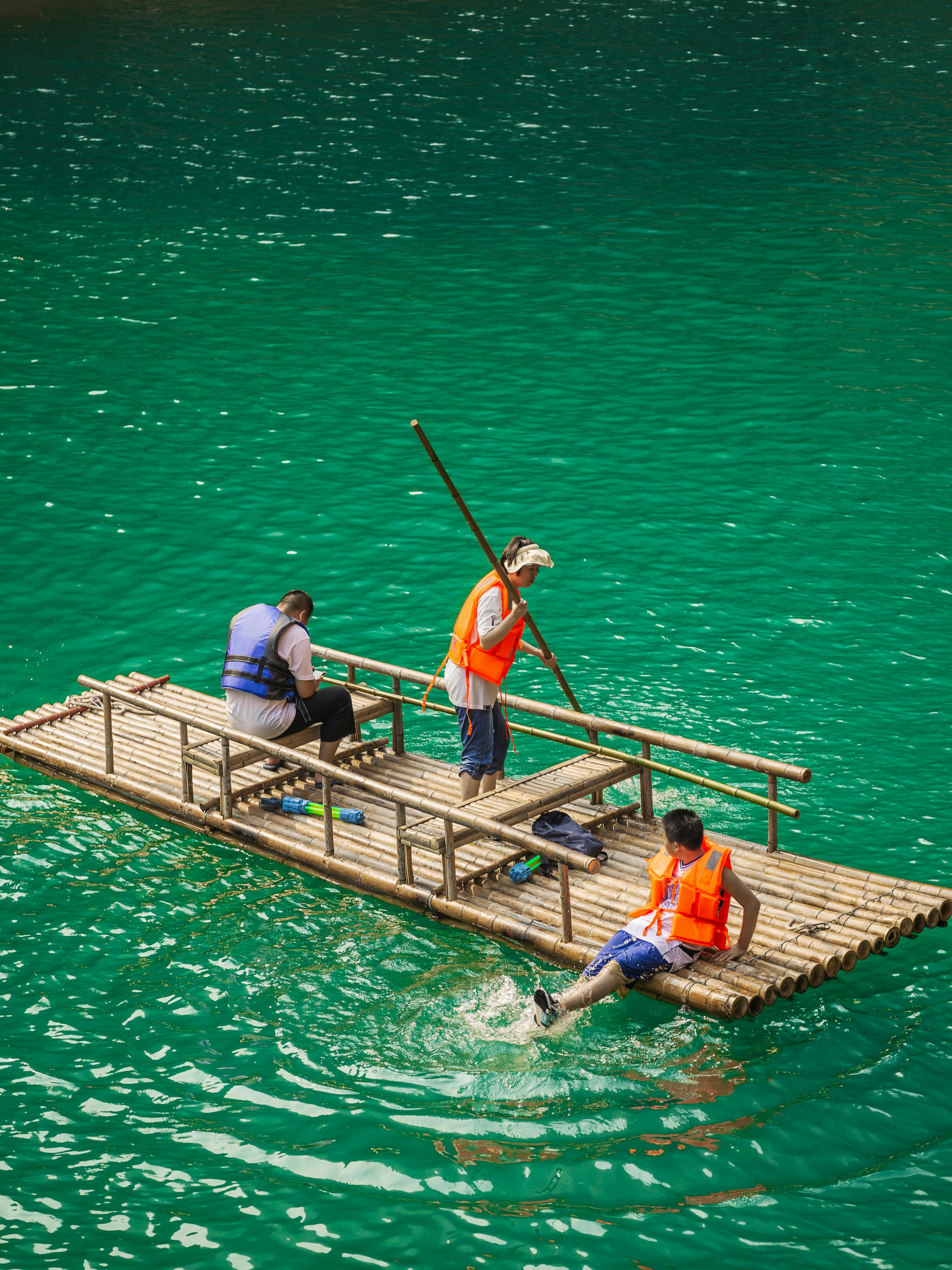 Men Swimming on a Raft · Free Stock Photo