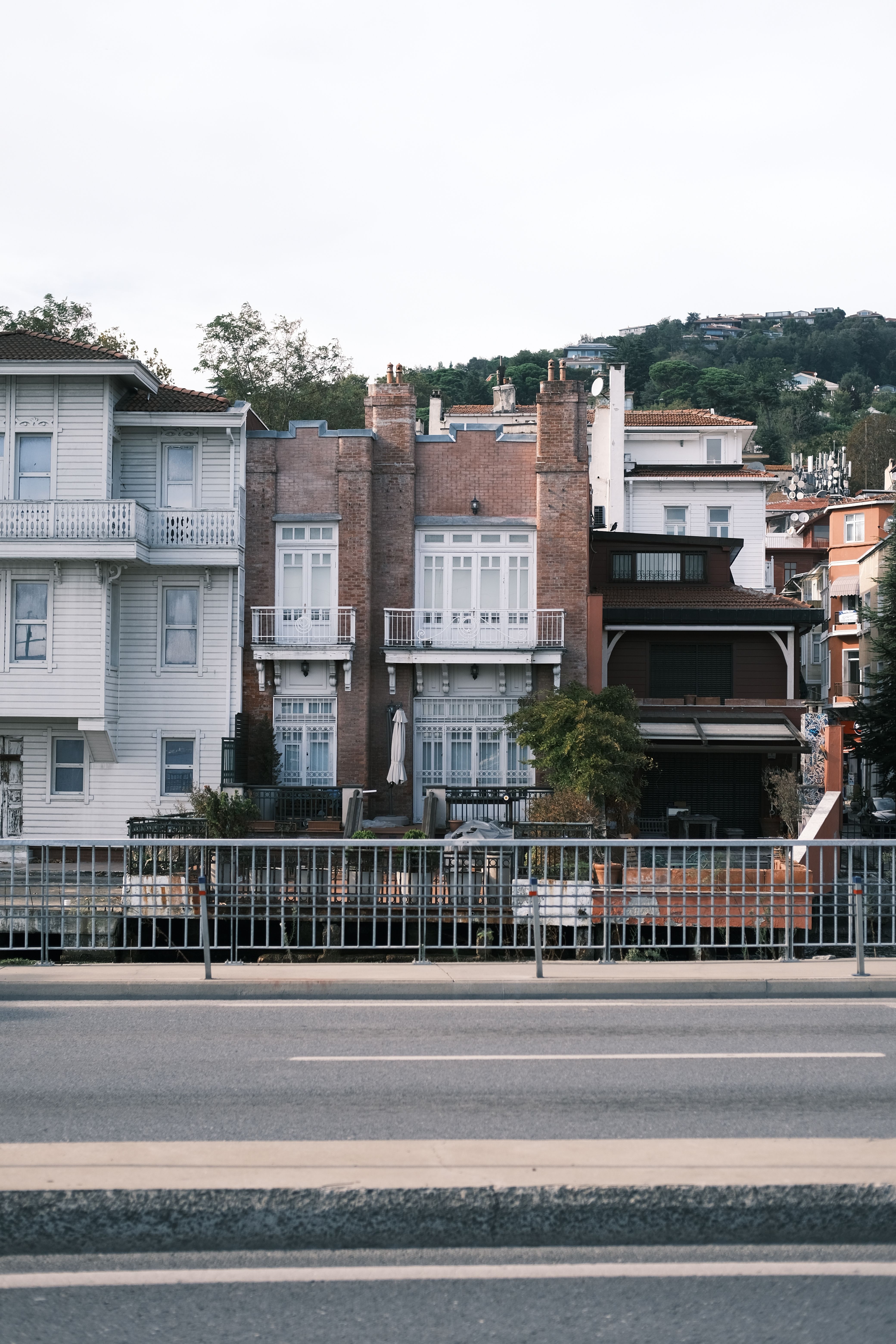 Residential Buildings behind Street · Free Stock Photo
