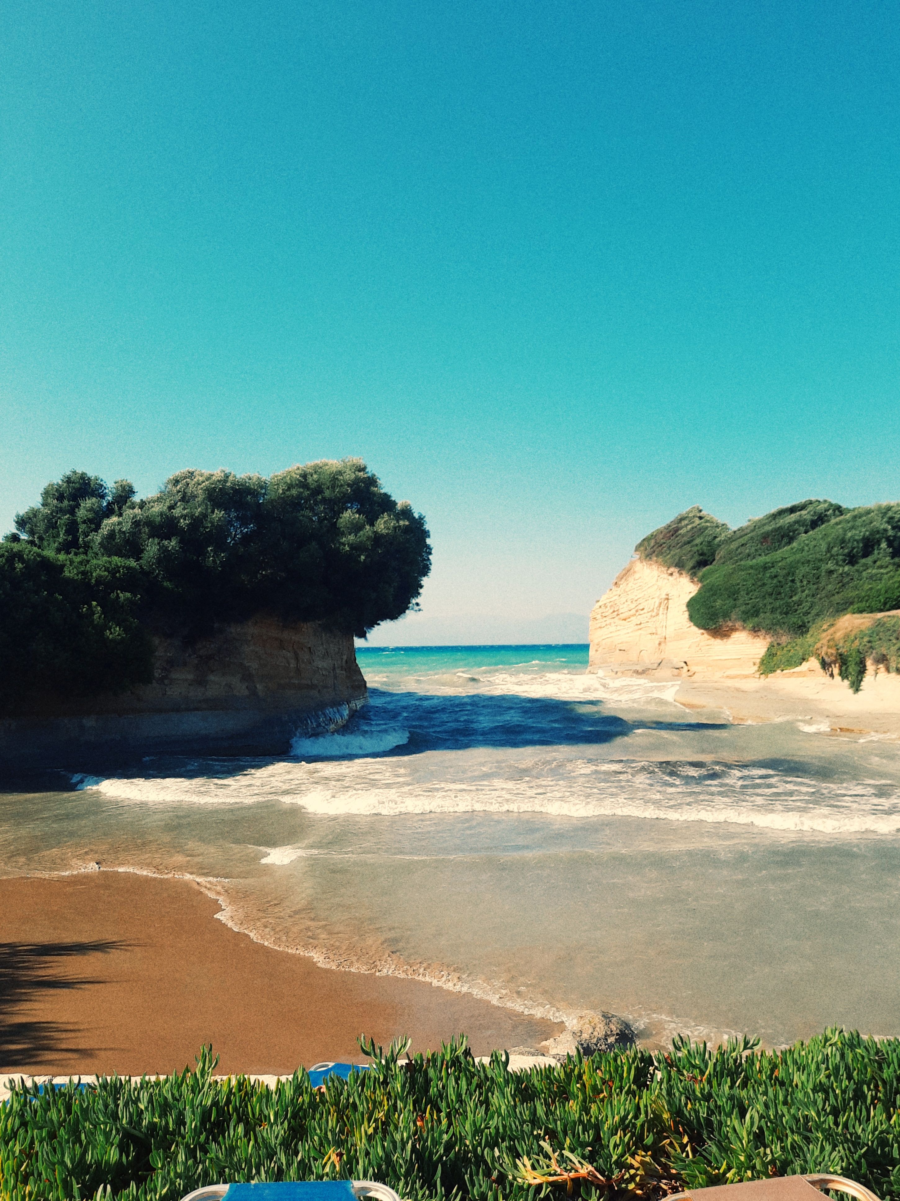 Terrace with View on Small Strait and Sandy Beach · Free Stock Photo