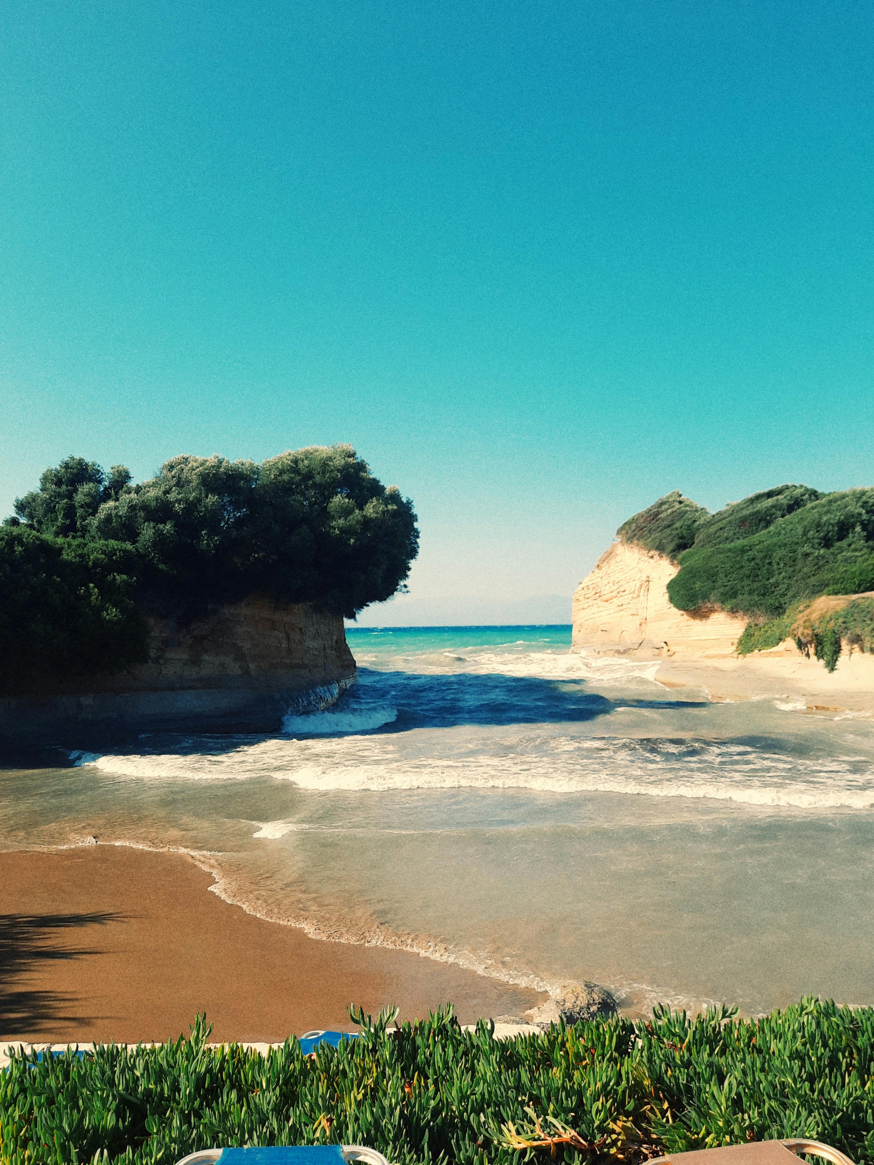 Terrace with View on Small Strait and Sandy Beach · Free Stock Photo