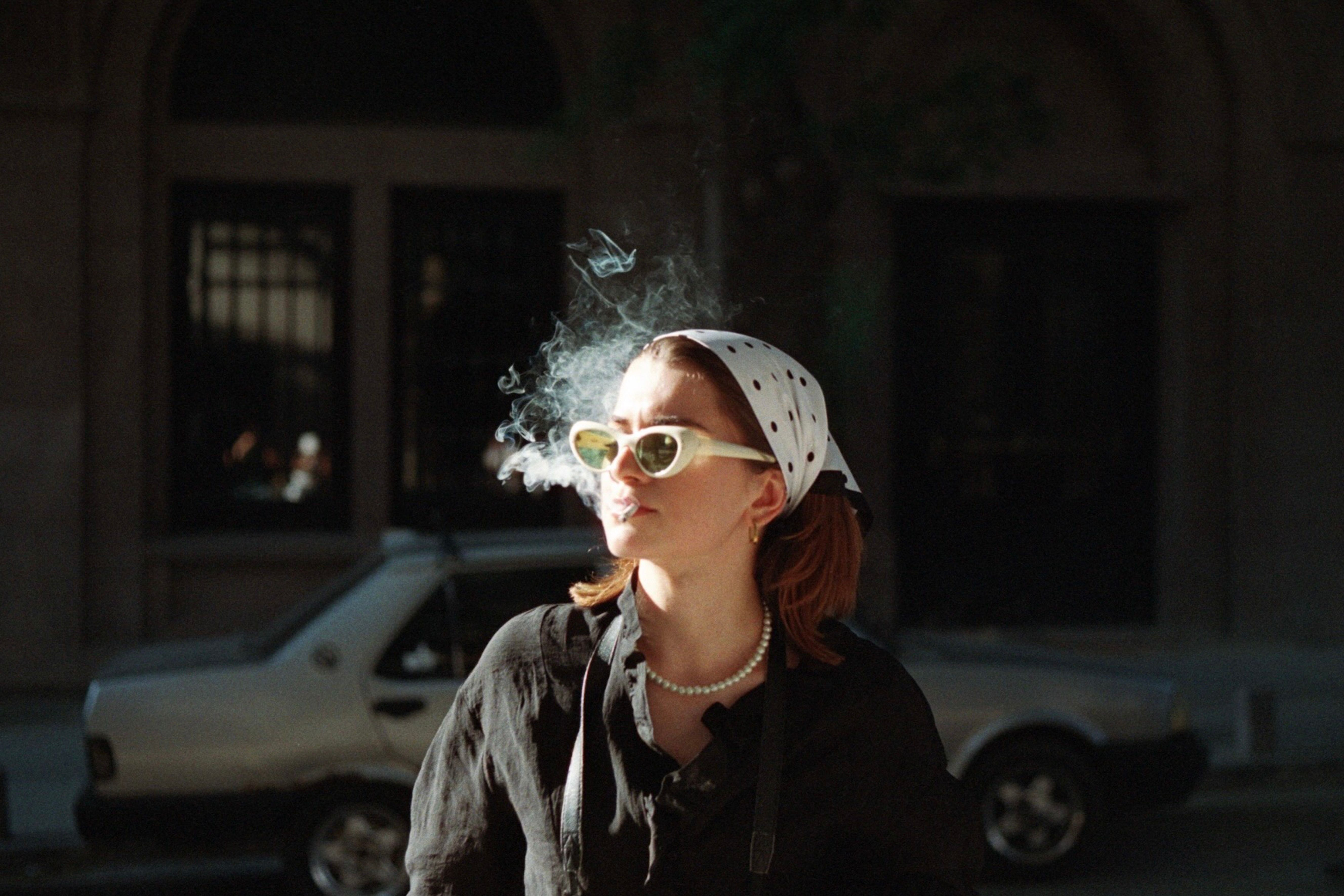 Woman in Retro Sunglasses and Spotted Headscarf Smoking Cigarette ...