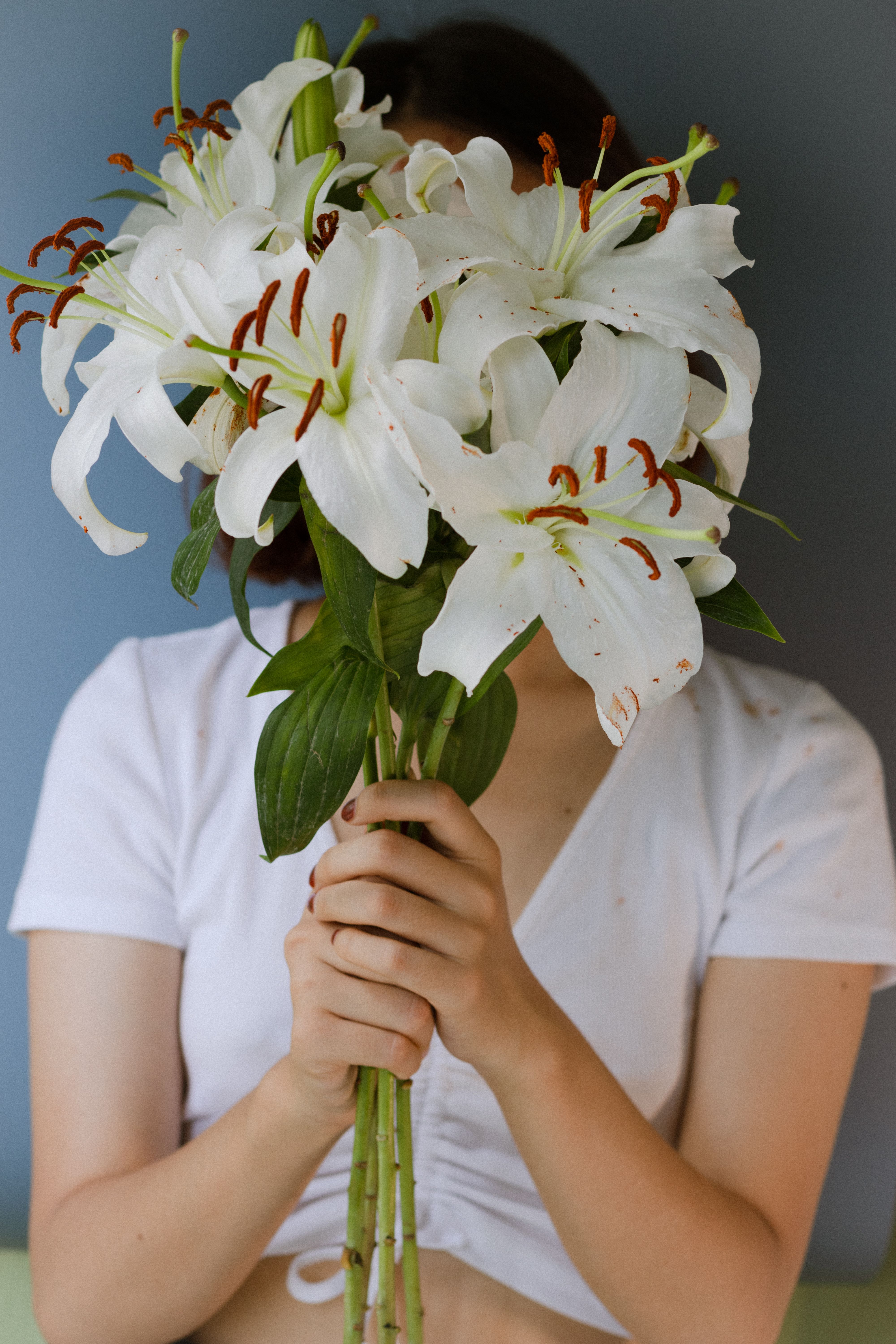 Woman Posing with Bouquet of Lilies · Free Stock Photo