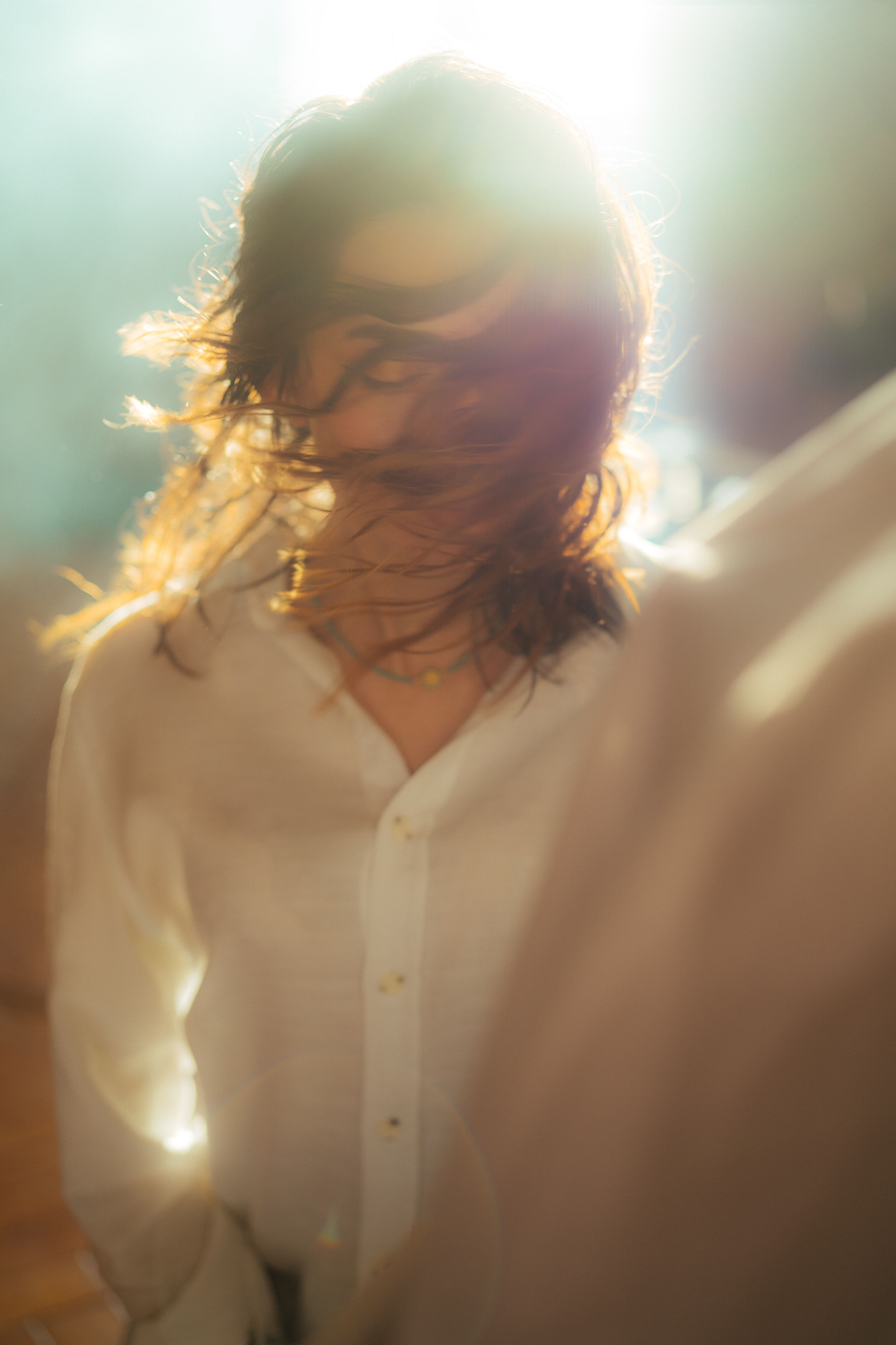 Sunlight over Woman in White Shirt · Free Stock Photo